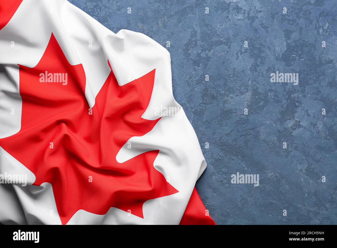 Flag of Canada on blue background Stock Photo - Alamy