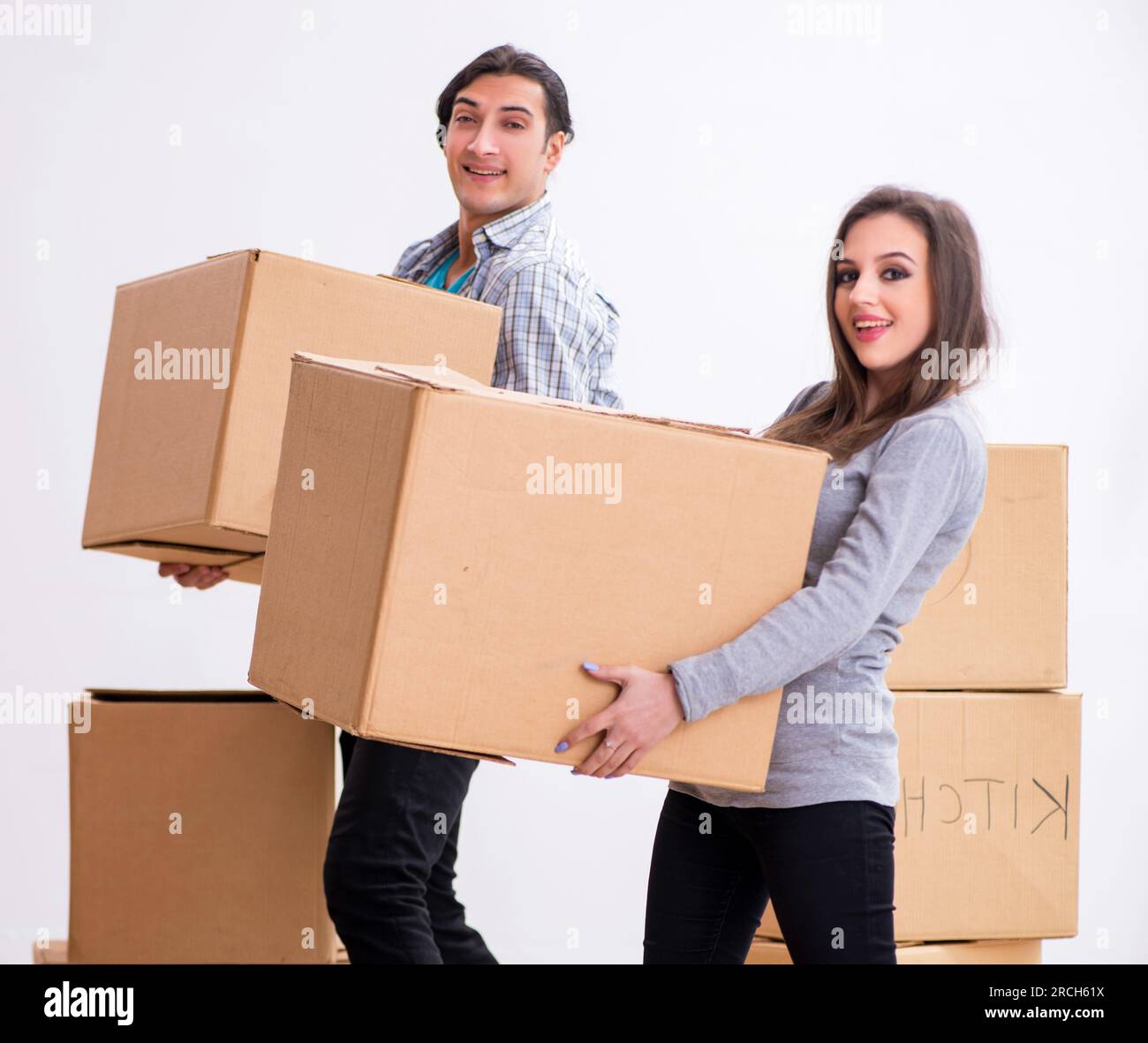 The young pair moving to new flat Stock Photo - Alamy