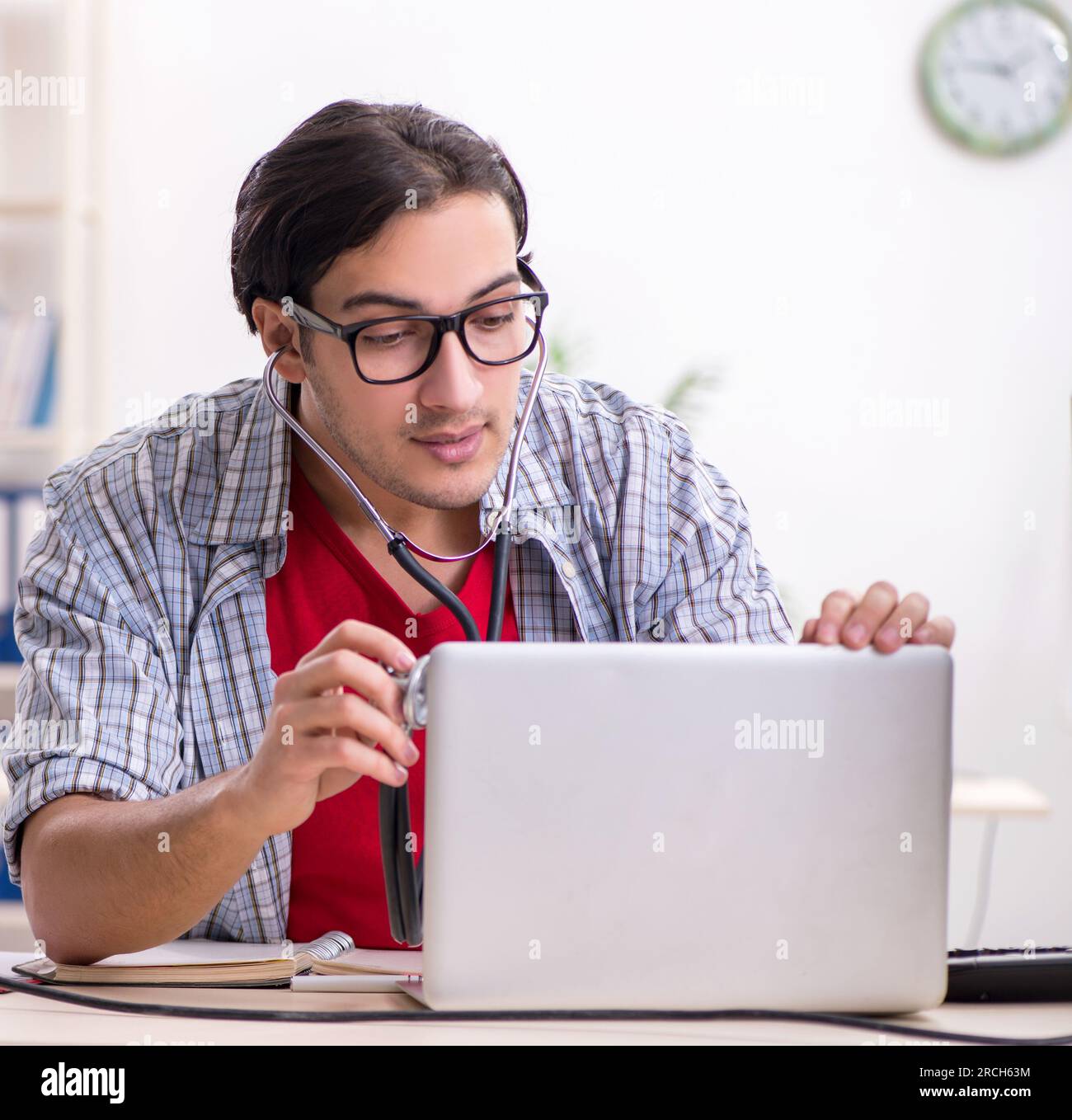 The male it specialist working in the office Stock Photo - Alamy