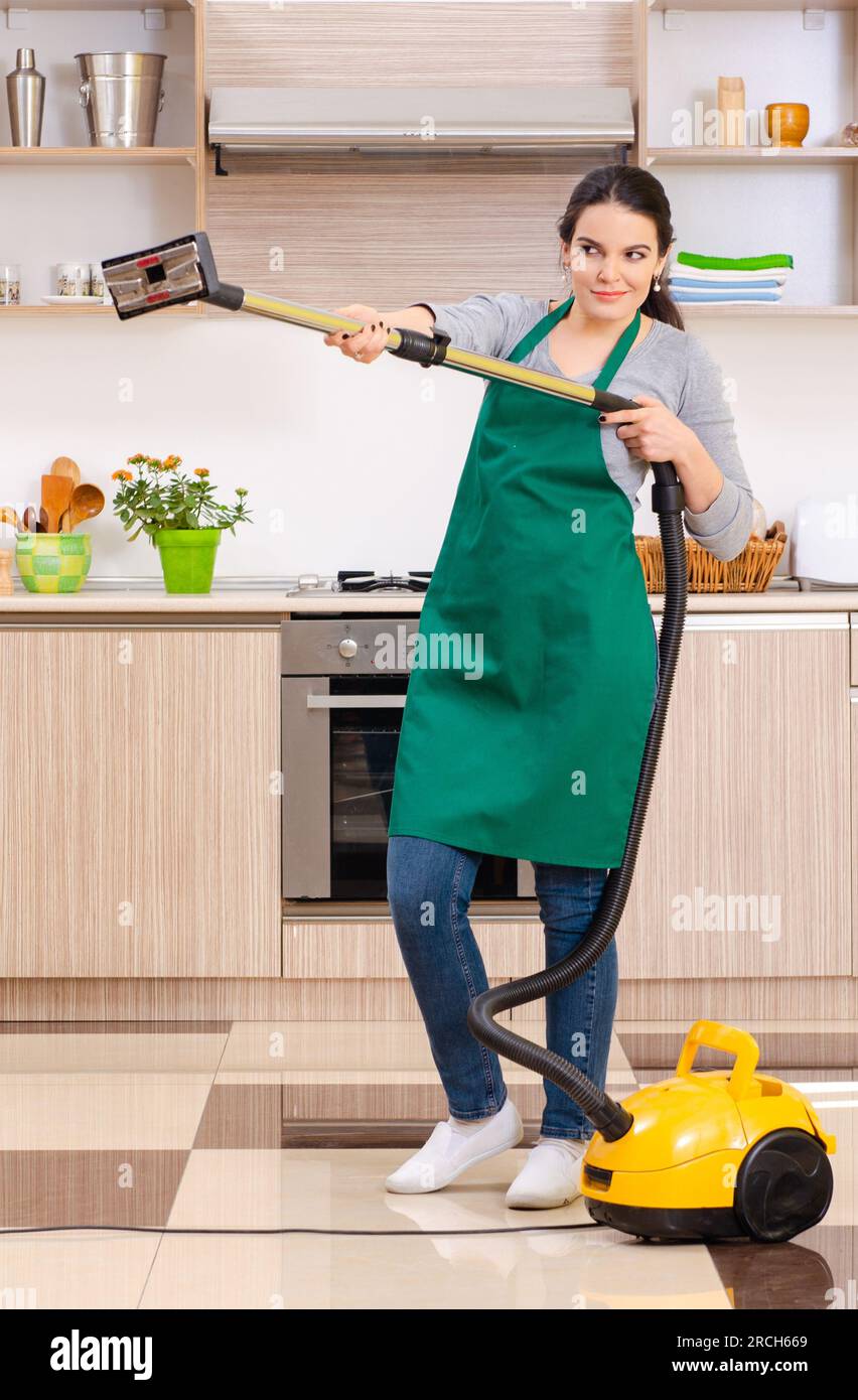 The young female contractor doing housework Stock Photo - Alamy