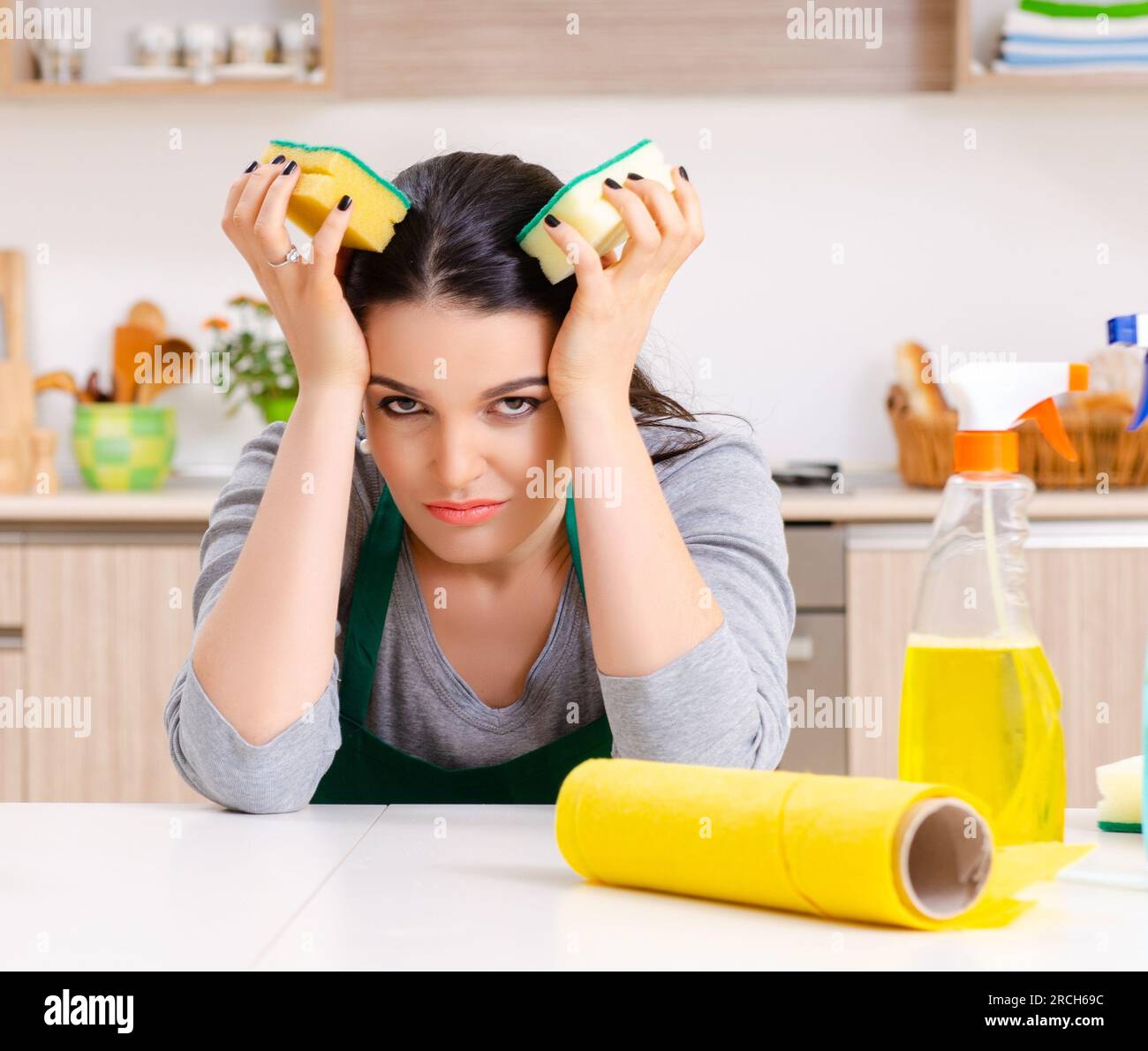 The young female contractor doing housework Stock Photo - Alamy