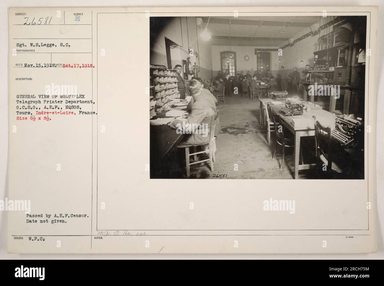 A photograph of Sgt. W.S. Legge at the Multiplex Telegraph Printer ...