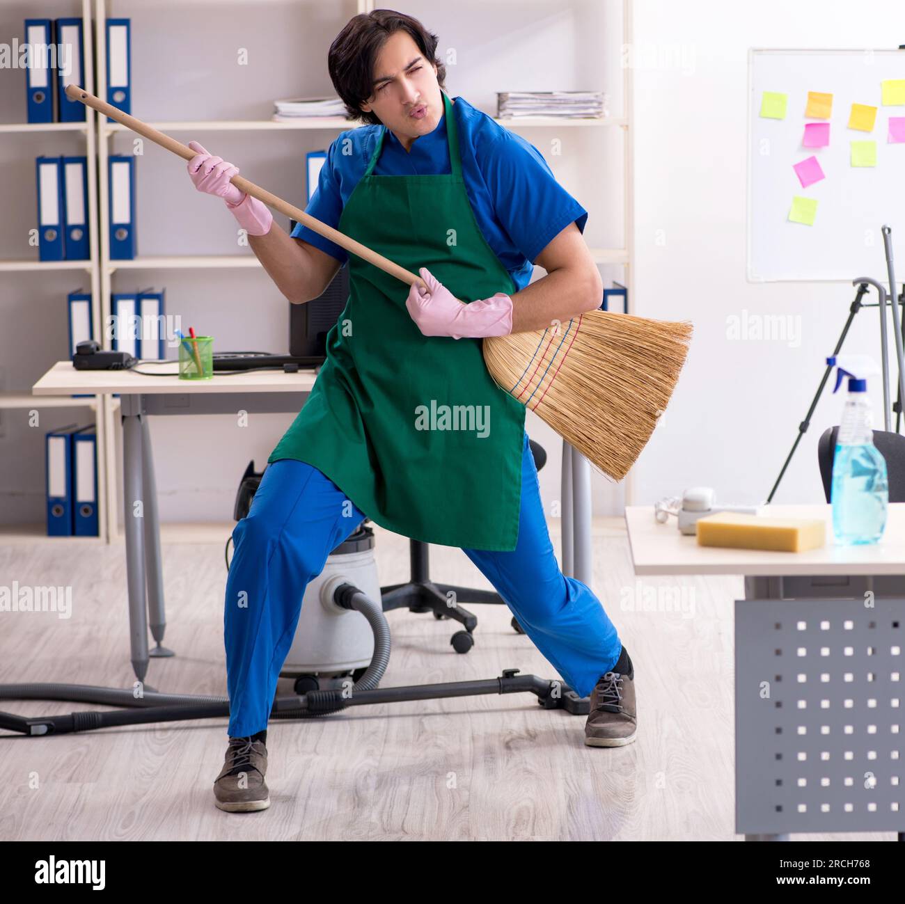 The male handsome professional cleaner working in the office Stock ...