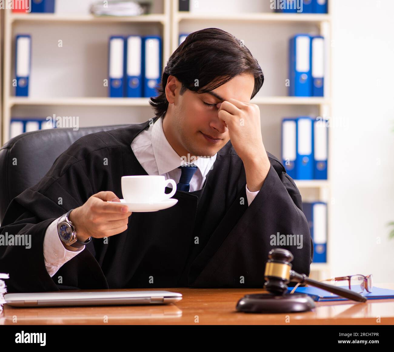 The young handsome judge working in court Stock Photo - Alamy