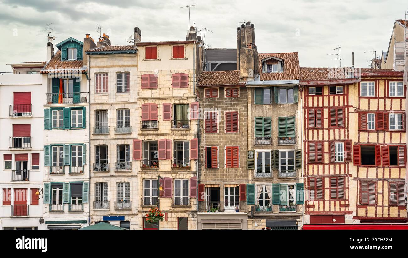 Typical old houses of Bayonne with their narrow buildings with colored ...