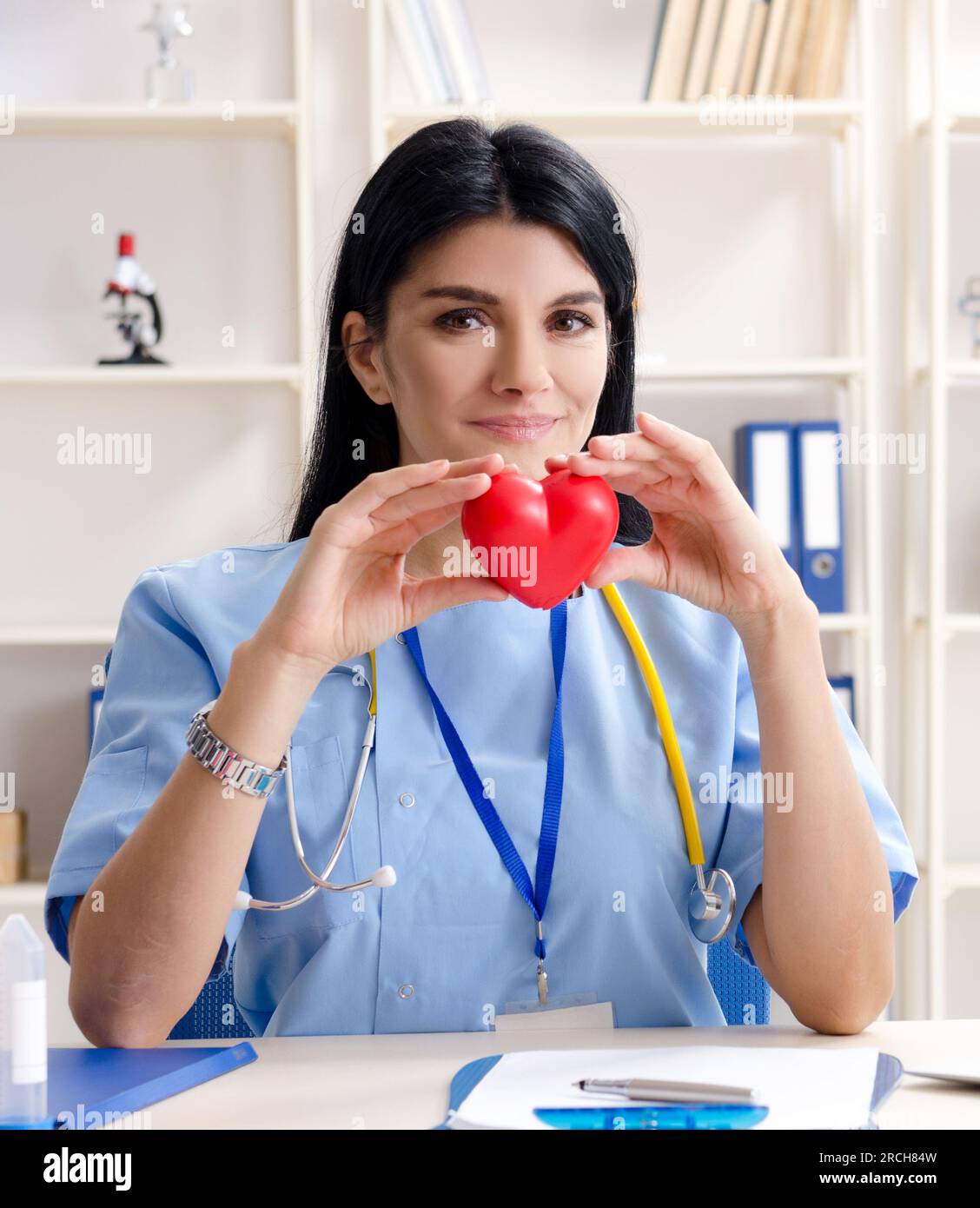 The female doctor cardiologist working in the clinic Stock Photo - Alamy