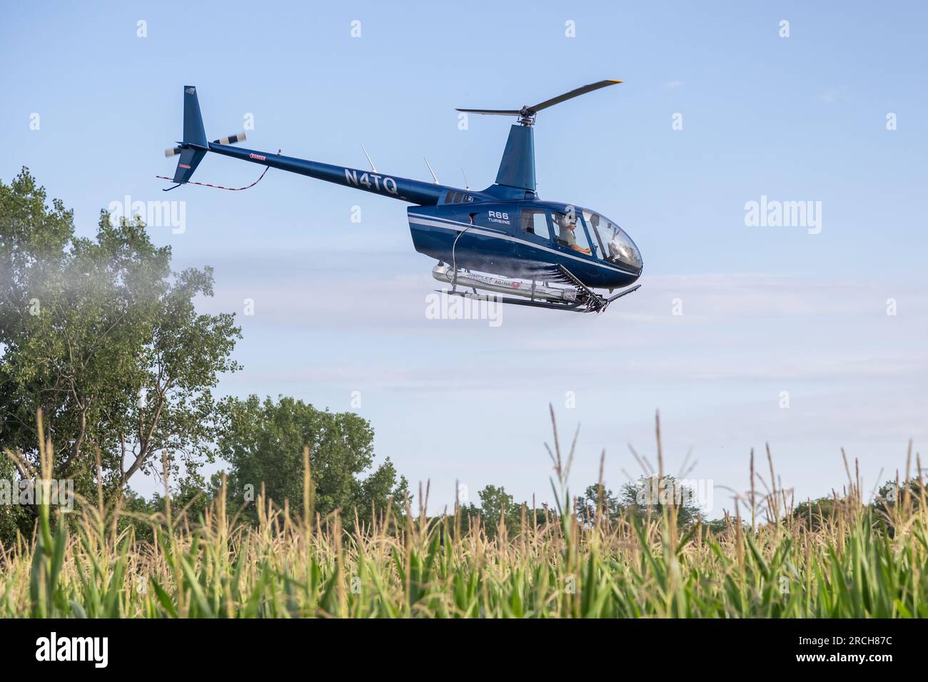 A Robinson R66 crop dusting helicopter from Black Nine Aerial of East ...