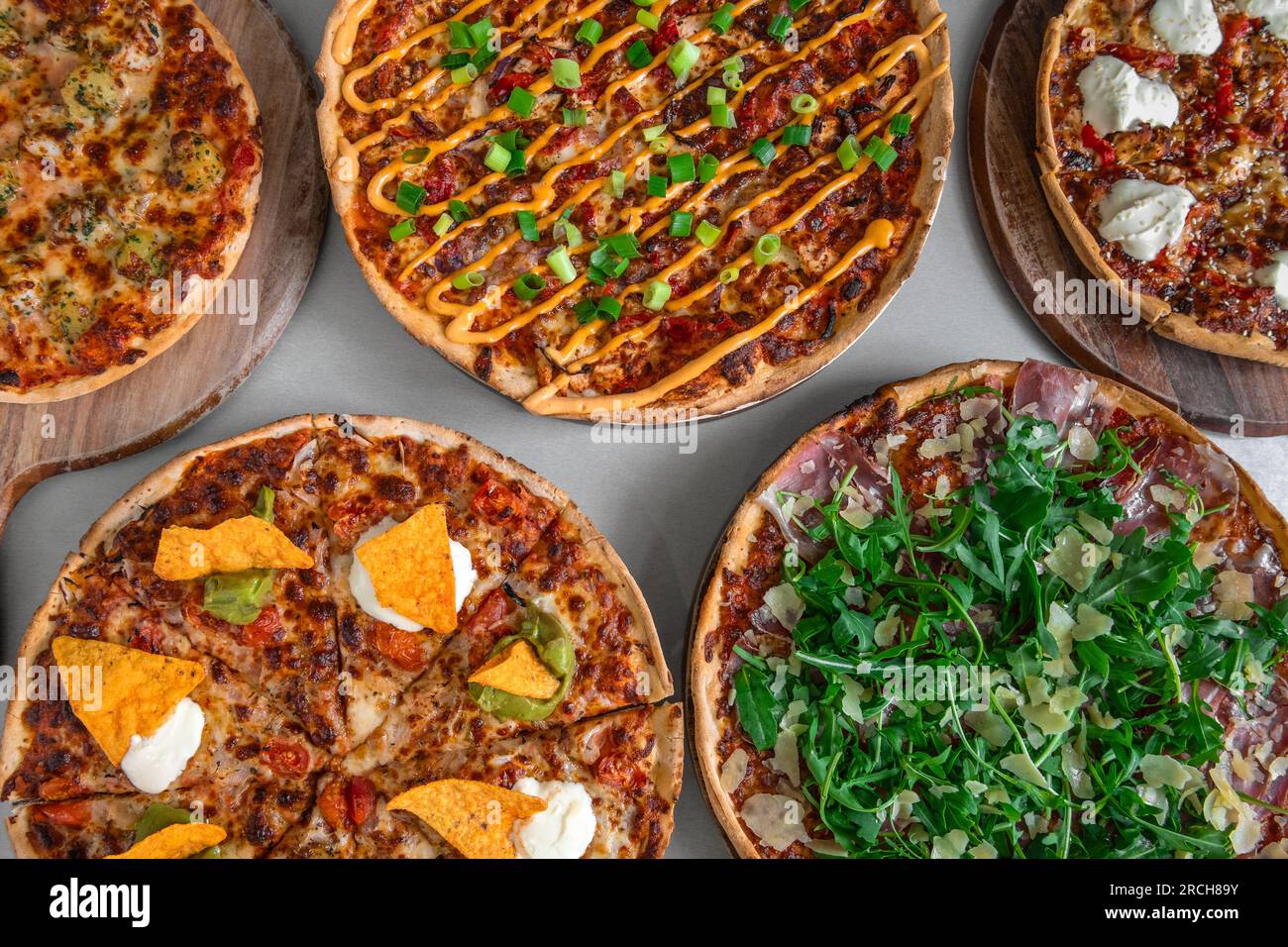 Set of pizzas isolated on white background. Top view Stock Photo - Alamy