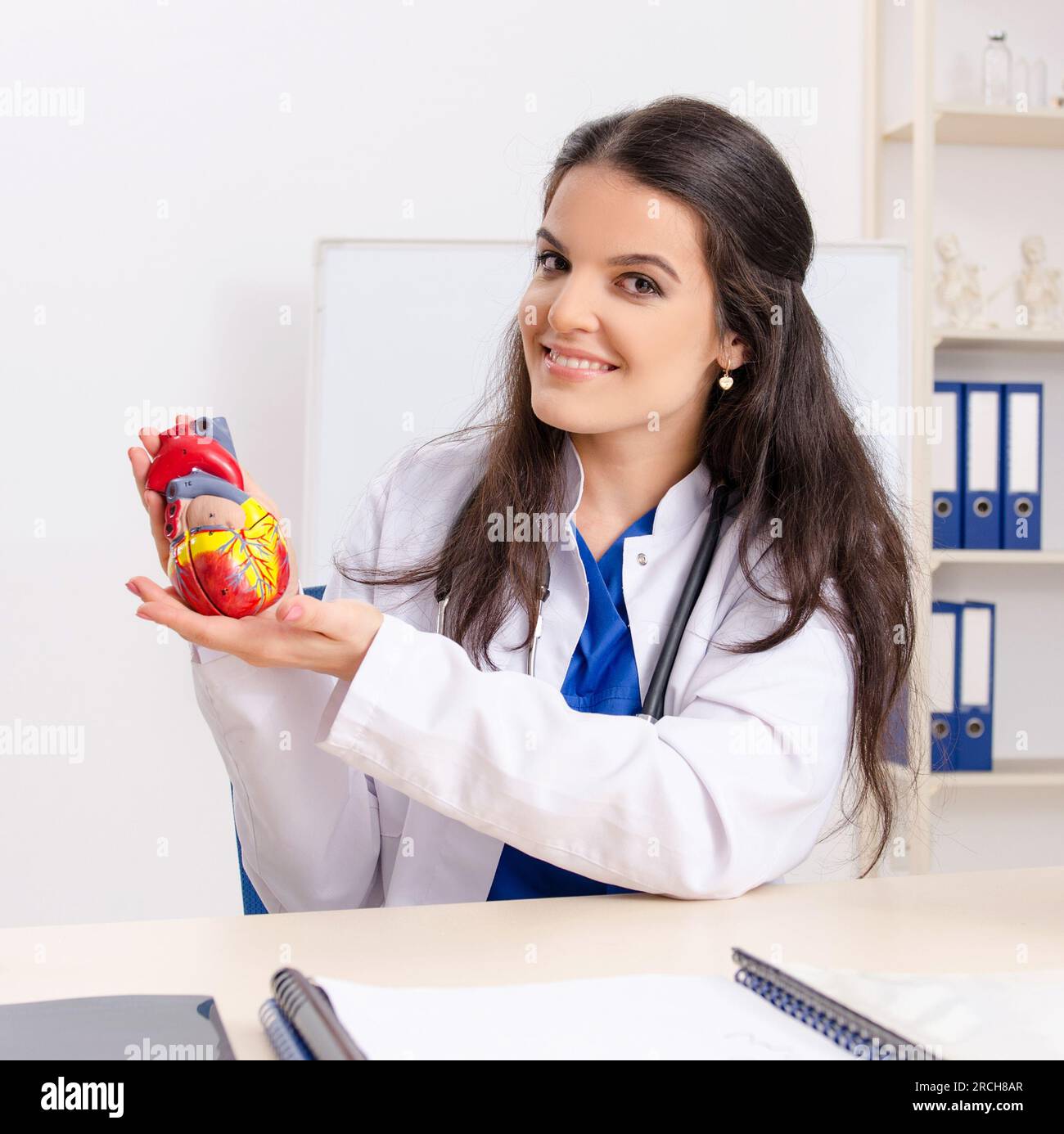 The female doctor cardiologist working in the clinic Stock Photo - Alamy