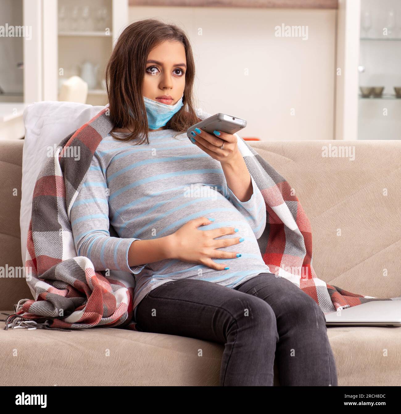 The sick pregnant woman suffering at home Stock Photo - Alamy