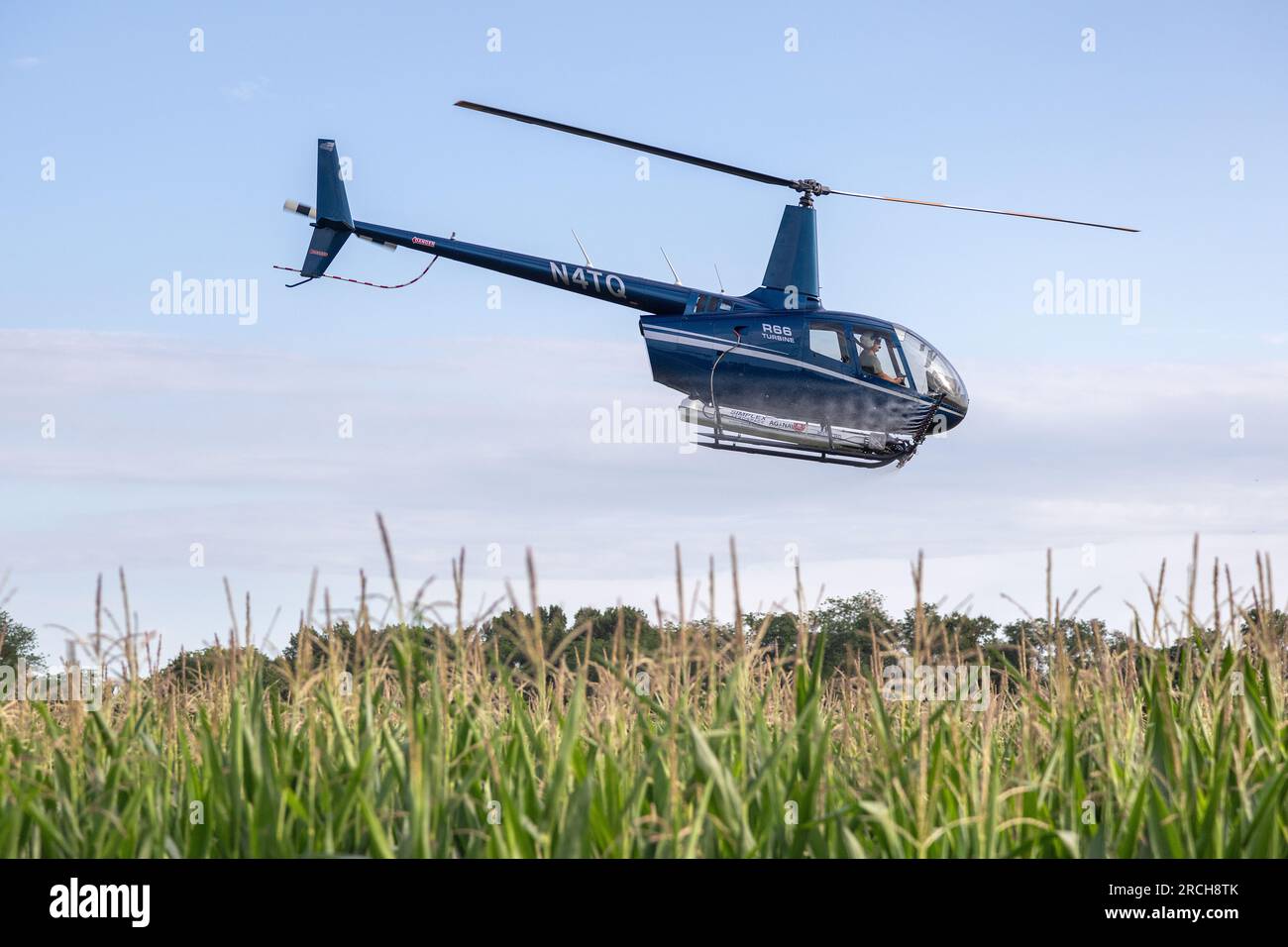 A Robinson R66 crop dusting helicopter from Black Nine Aerial of East ...