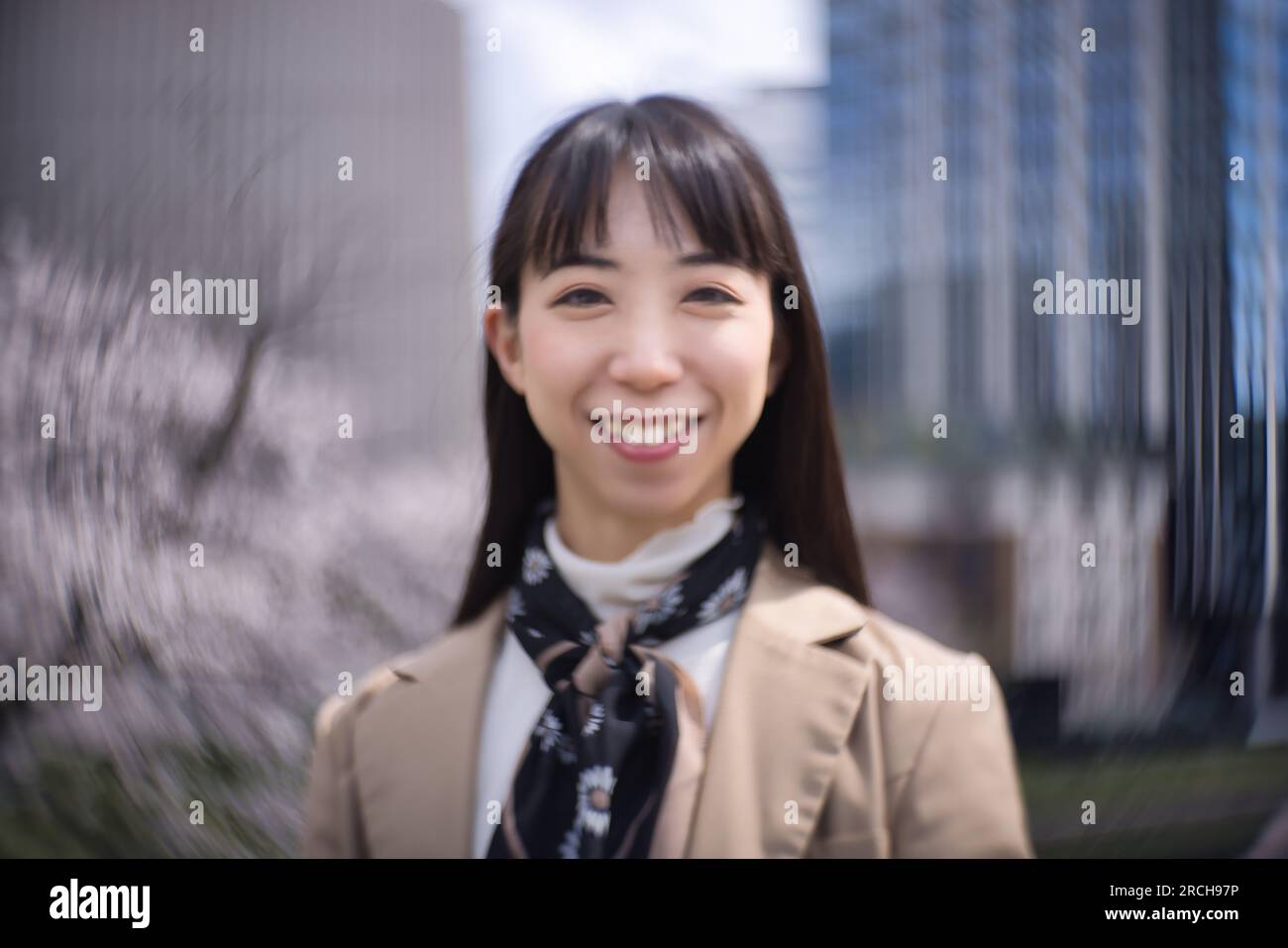 A swirly portrait of Japanese woman behind cherry blossom closeup Stock ...