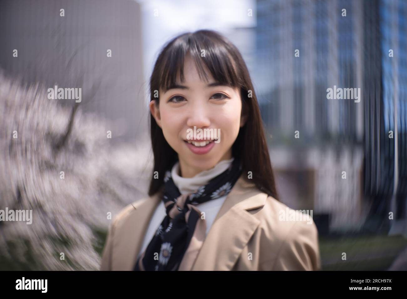 A swirly portrait of Japanese woman behind cherry blossom closeup Stock ...