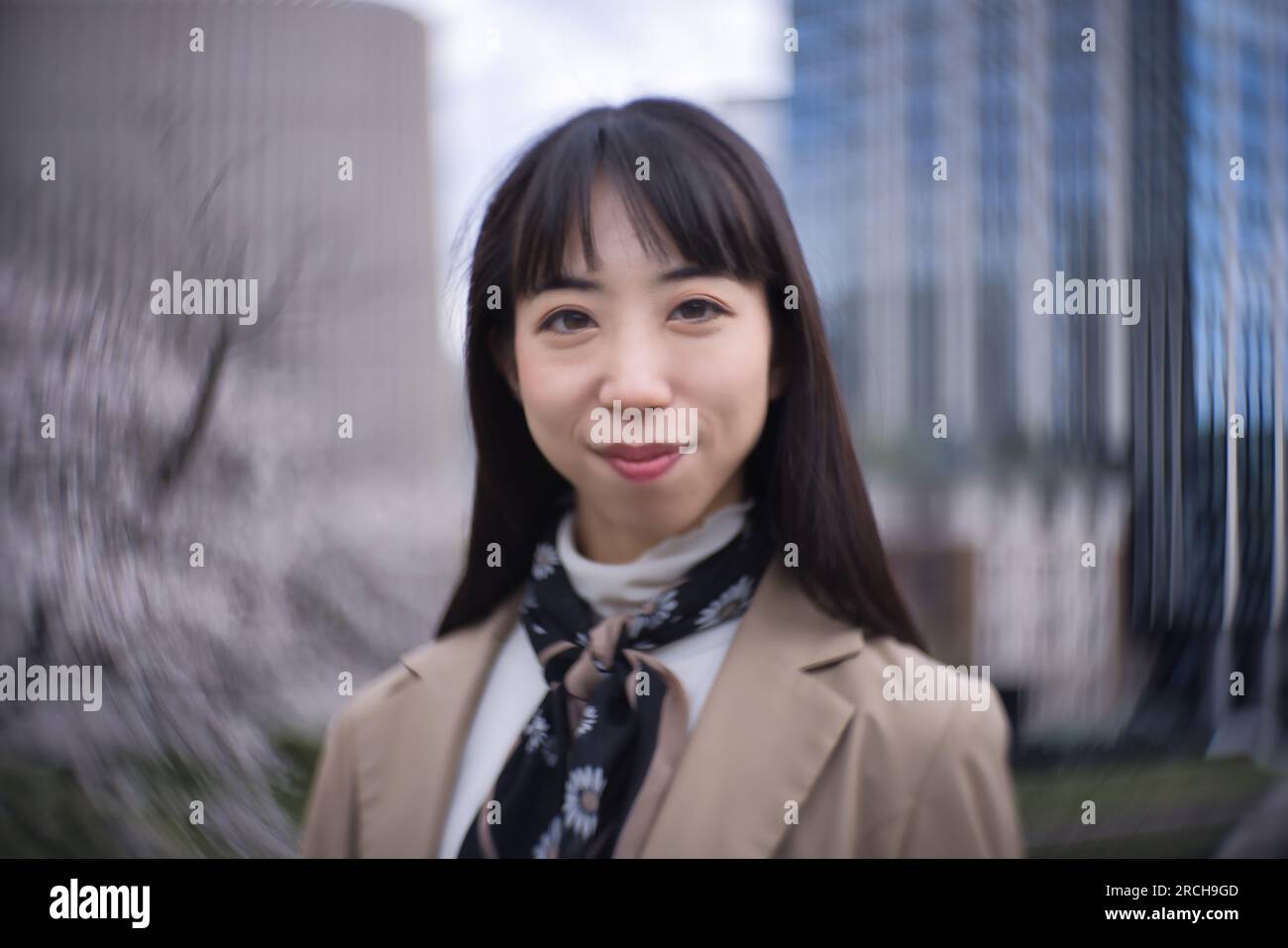 A swirly portrait of Japanese woman behind cherry blossom closeup Stock ...