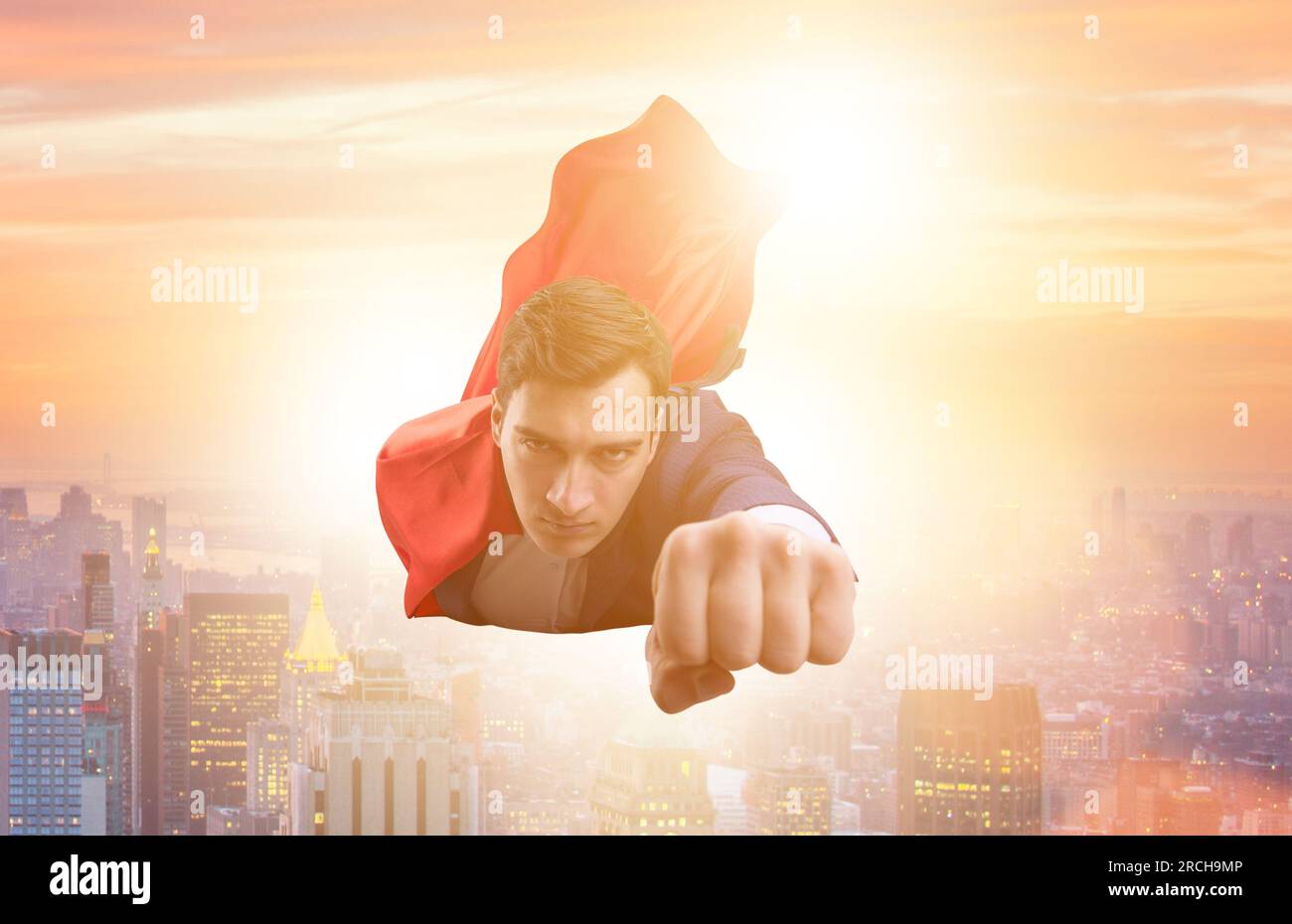 The superhero businessman flying over the city Stock Photo - Alamy
