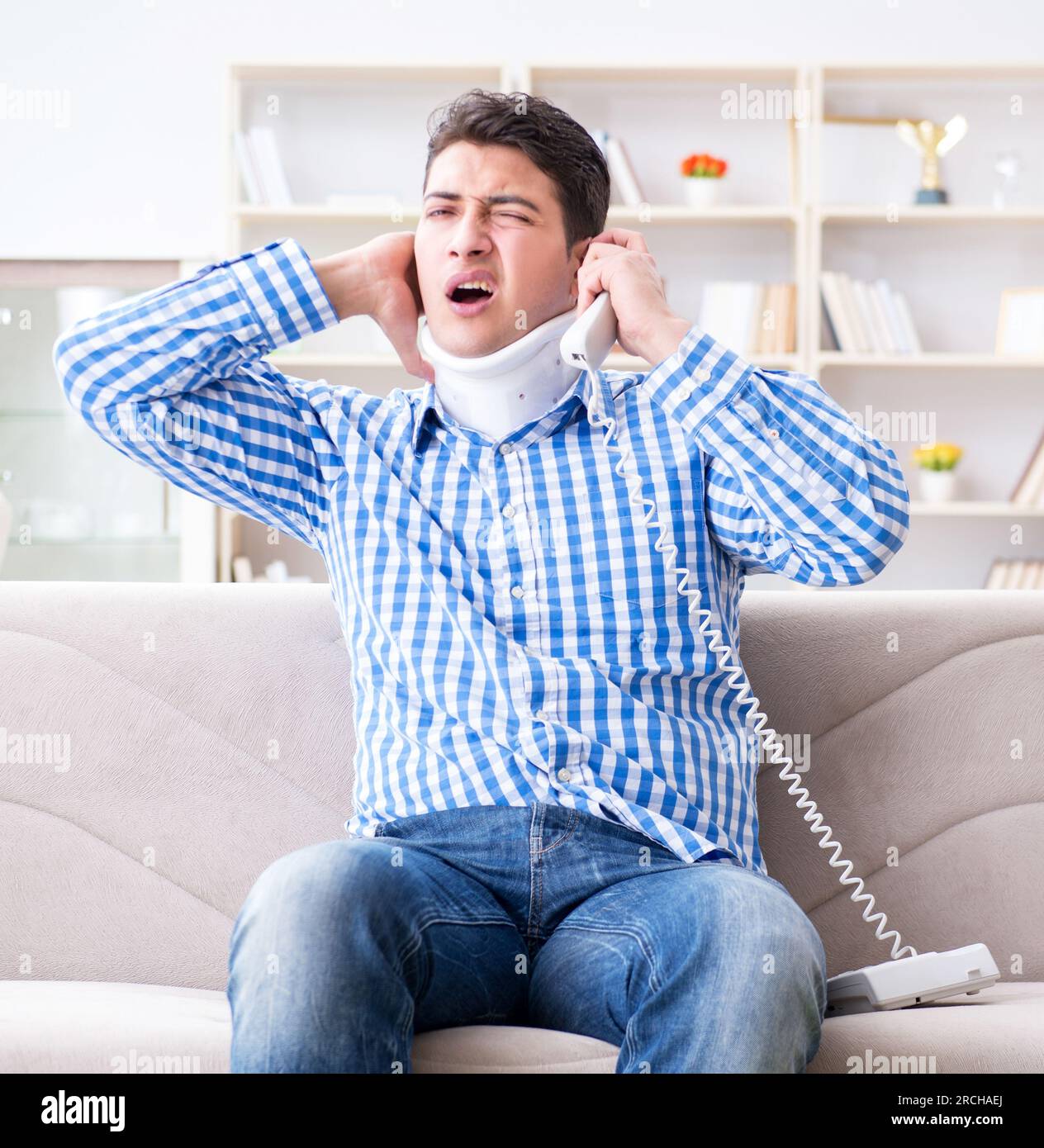 Man with a head neck spine trauma wearing a neck brace cervical collar ...