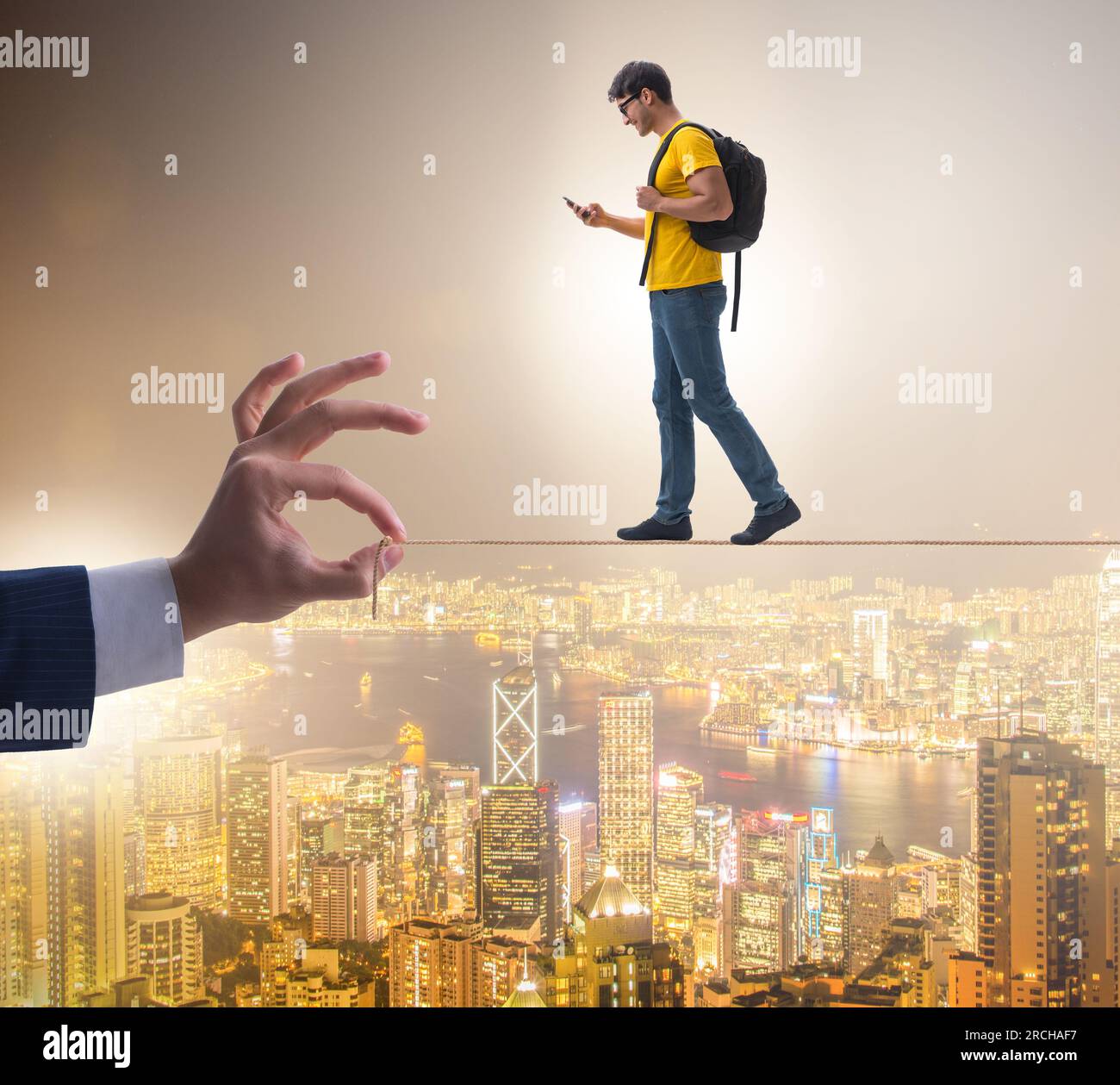 The student walking on tight rope Stock Photo - Alamy