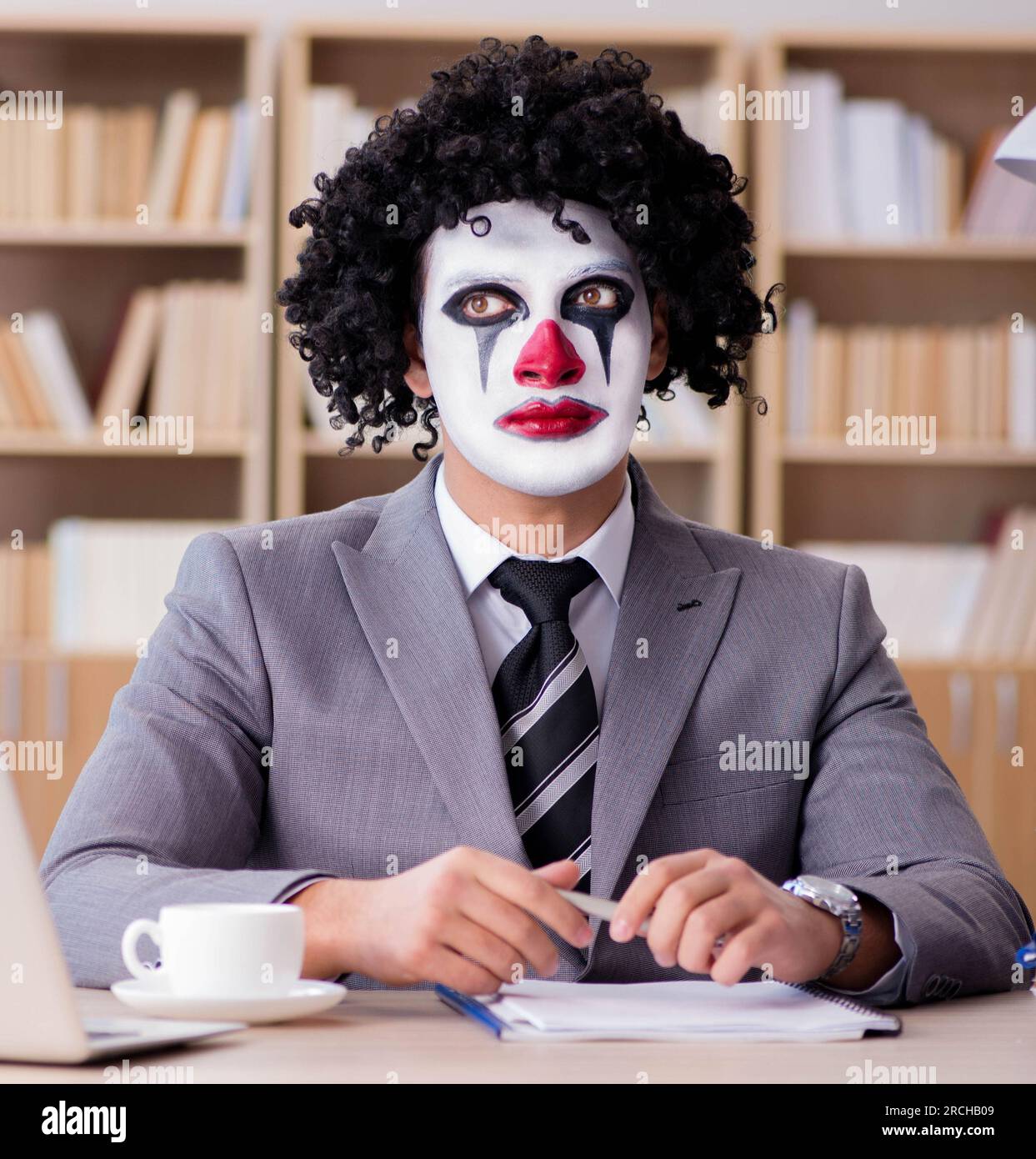 The clown businessman working in the office Stock Photo - Alamy