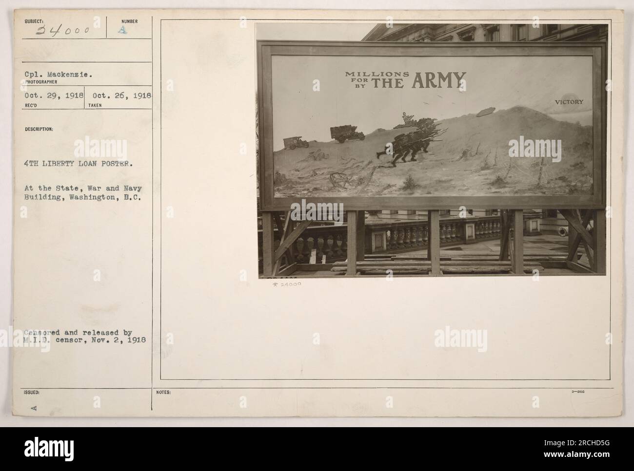 "Cpl. Mackenzie posing next to a 4th Liberty Loan poster at the State ...