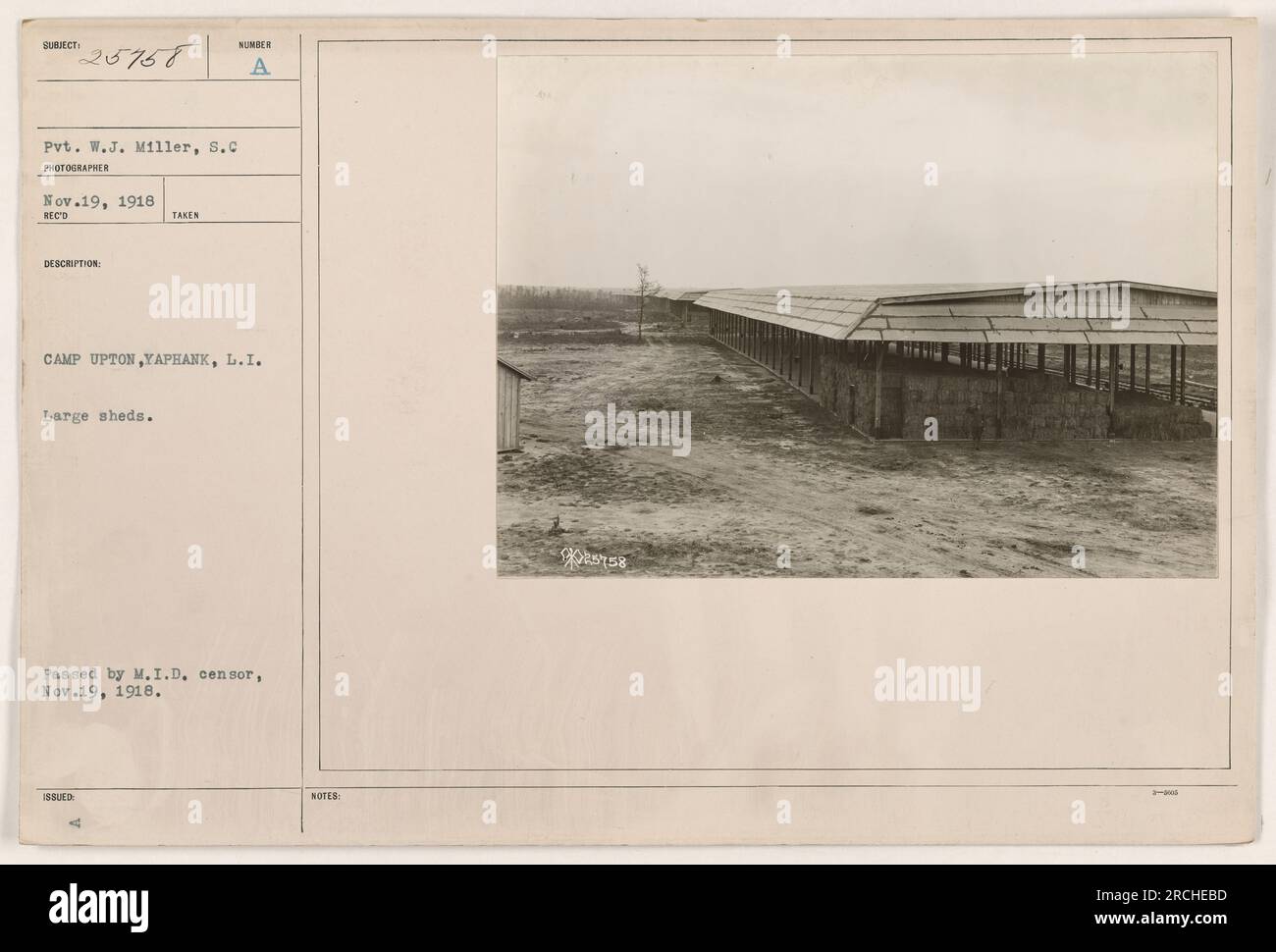 Soldiers standing in front of large sheds at Camp Upton, Yaphank, Long ...