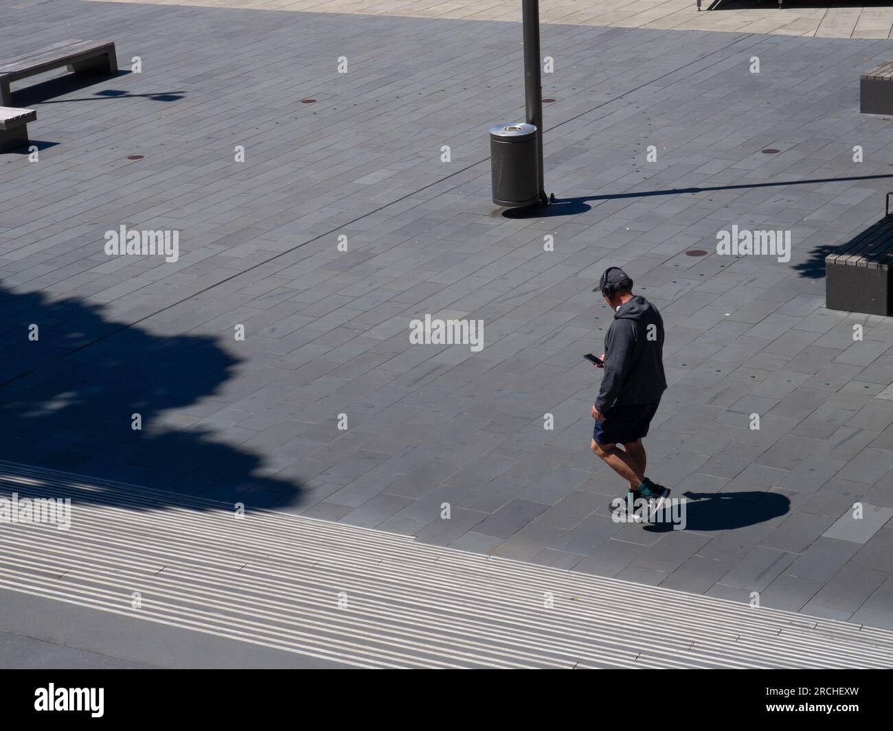 From The Top Of Steps Down To A Man Walking Along The Sidewalk Stock ...