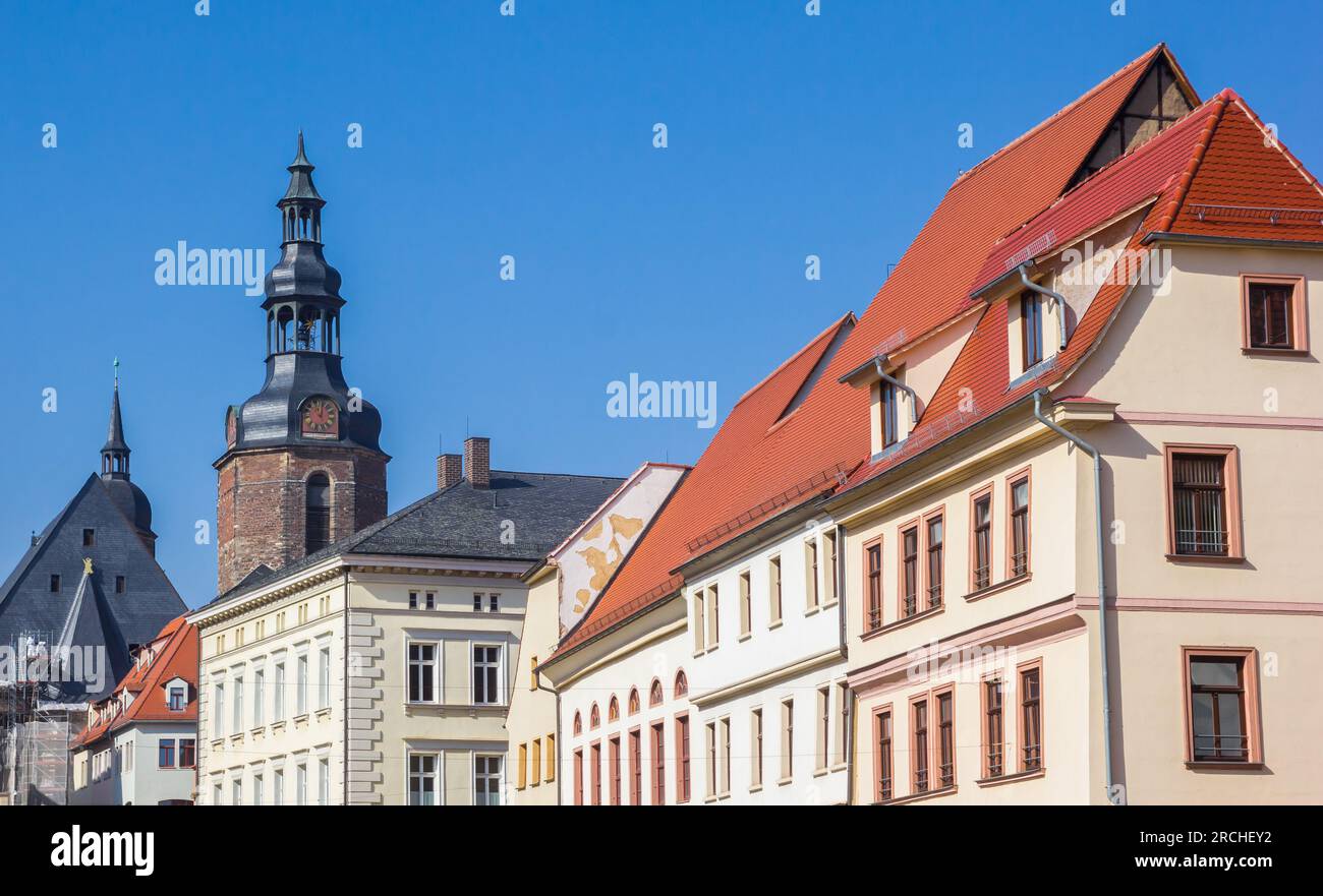 Old houses and church tower at the market square of Eisleben, Germany ...