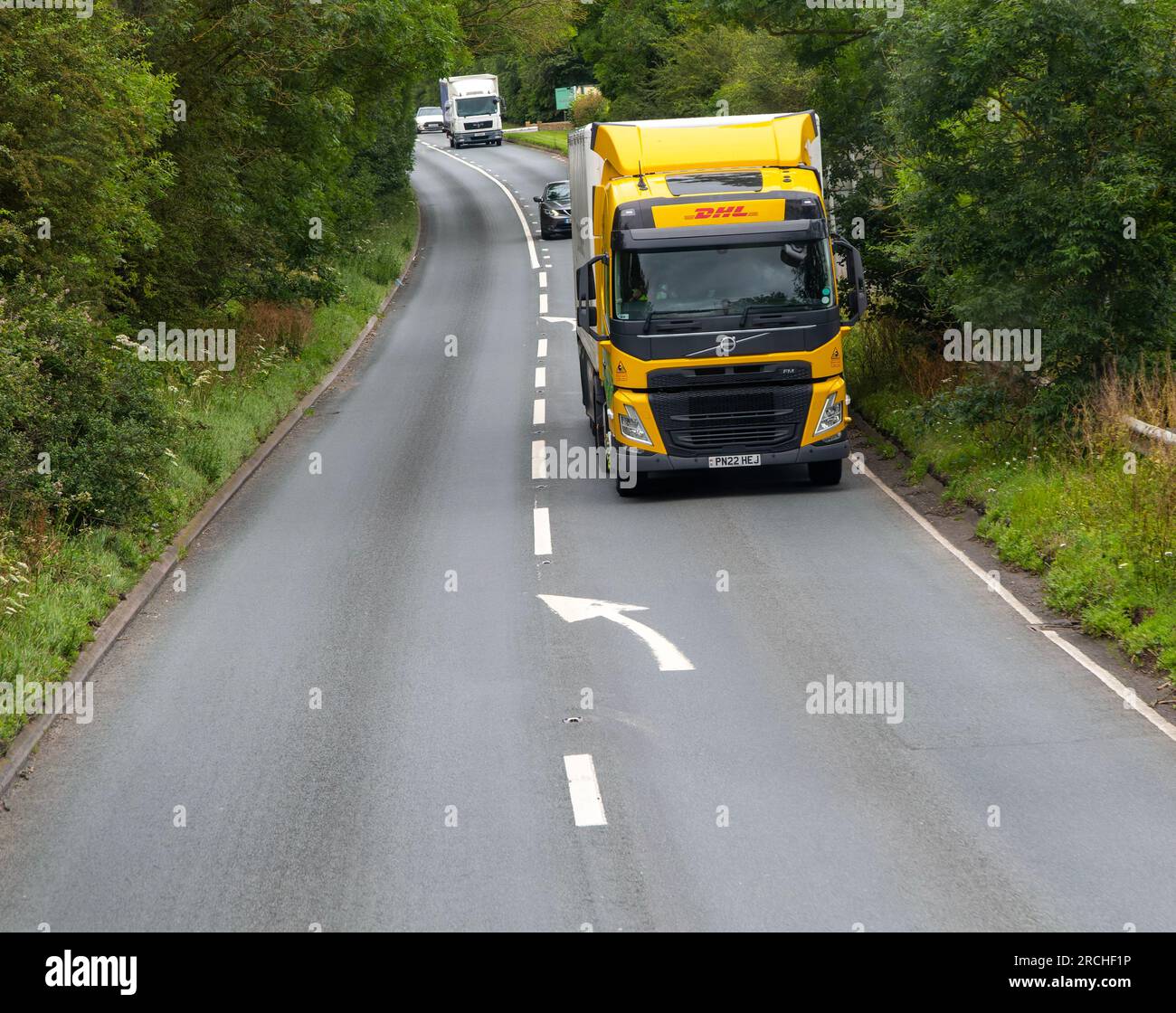 DHL truck lorry heavy goods delivery vehicle on A346 main road ...