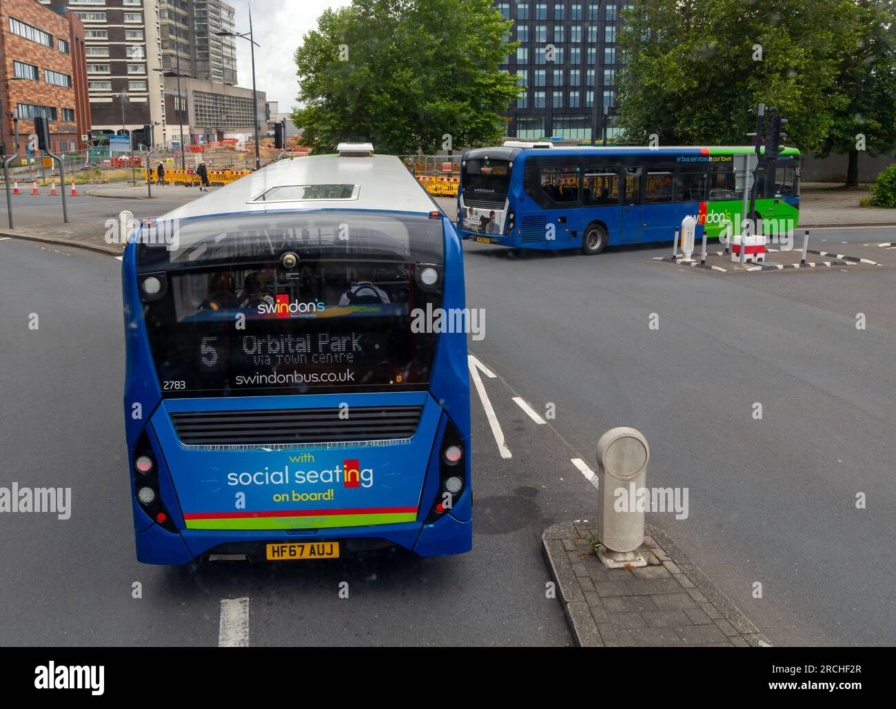 View through bus window of single-decker buses in town centre, Swindon ...