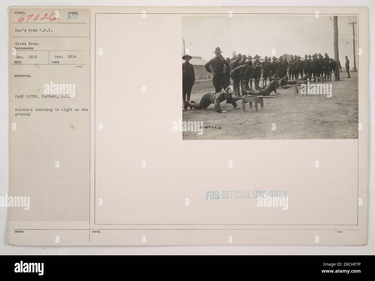 Soldiers at Camp Upton, Yaphank, Long Island, are seen learning how to sight on the ground. This ...