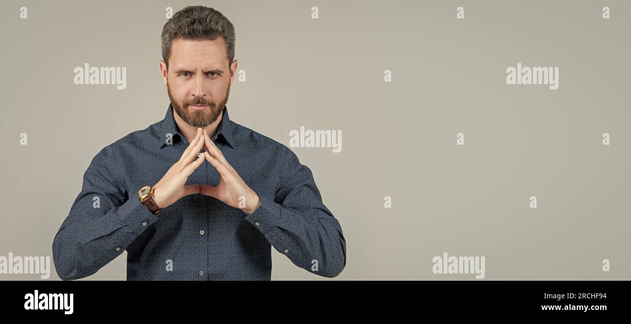 Unshaven man in business casual style show raised steeple hand gesture ...