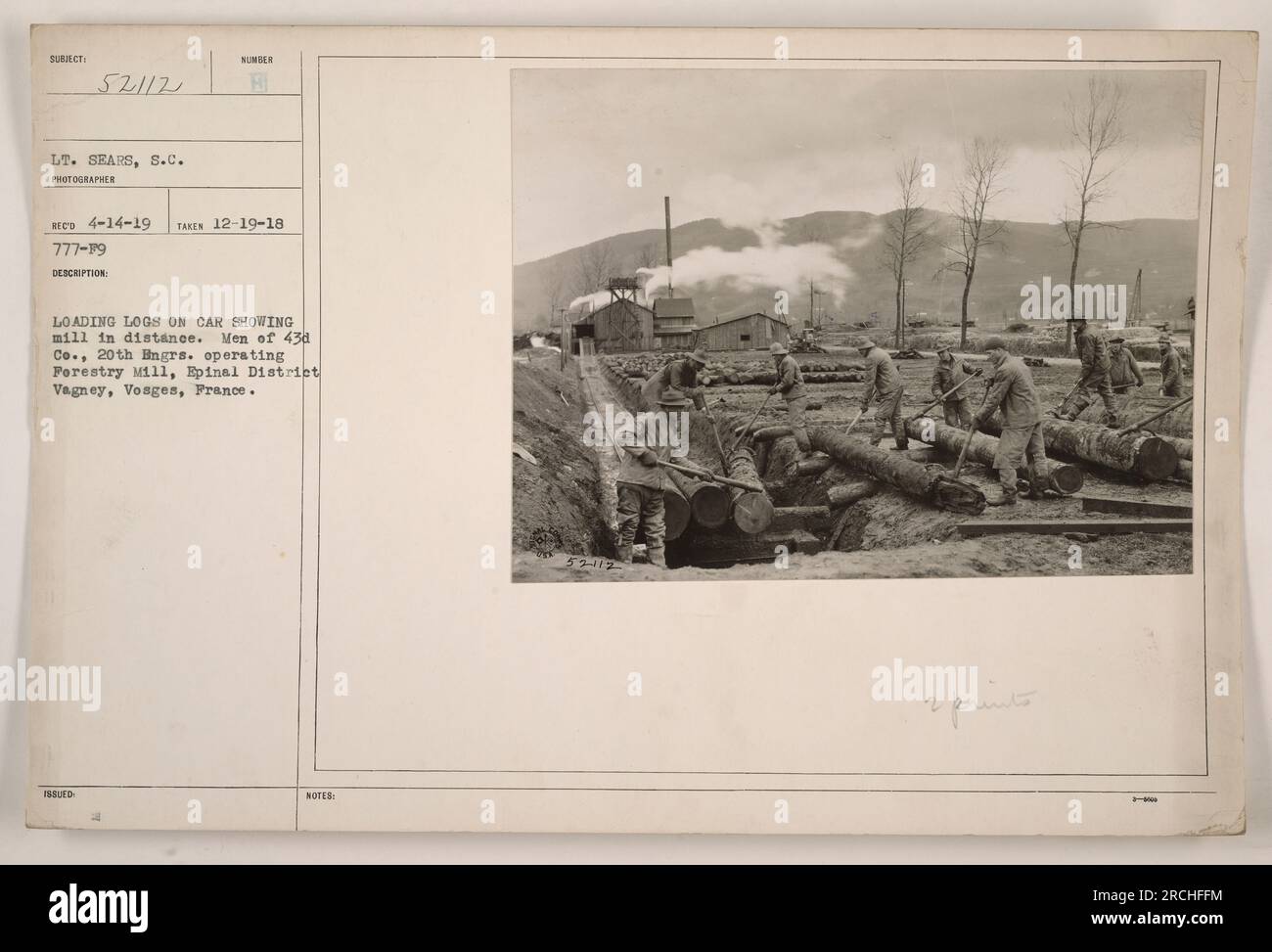 Men from the 43rd Company, 20th Engineers, are seen loading logs onto a ...