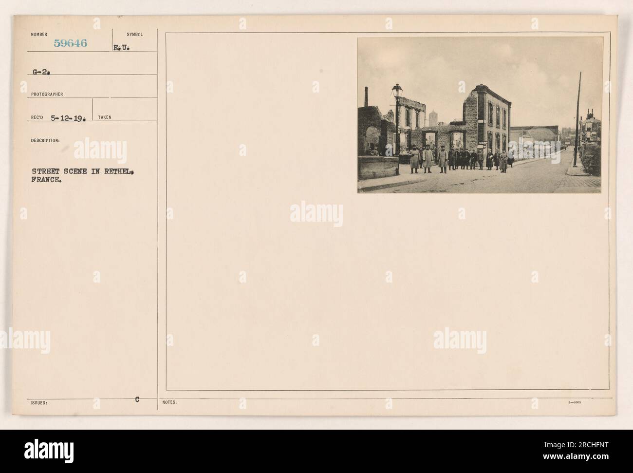 Soldiers and civilians gather in a bustling street in Rethel, France ...