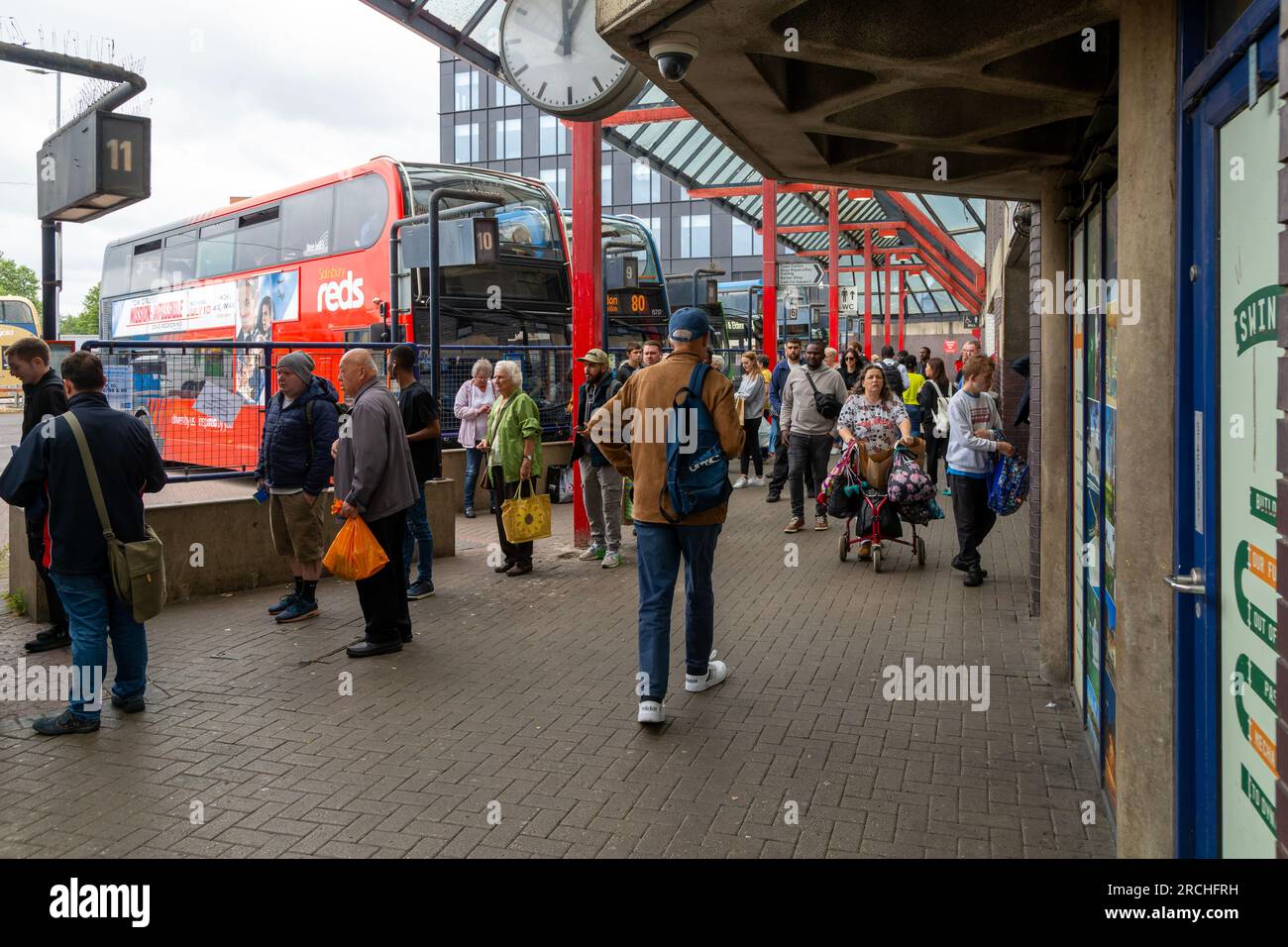 People and buses in bus station in the town centre, Swindon, Wiltshire ...