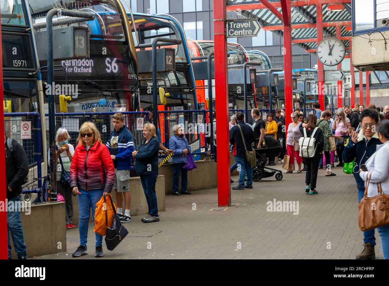 People and buses in bus station in the town centre, Swindon, Wiltshire ...
