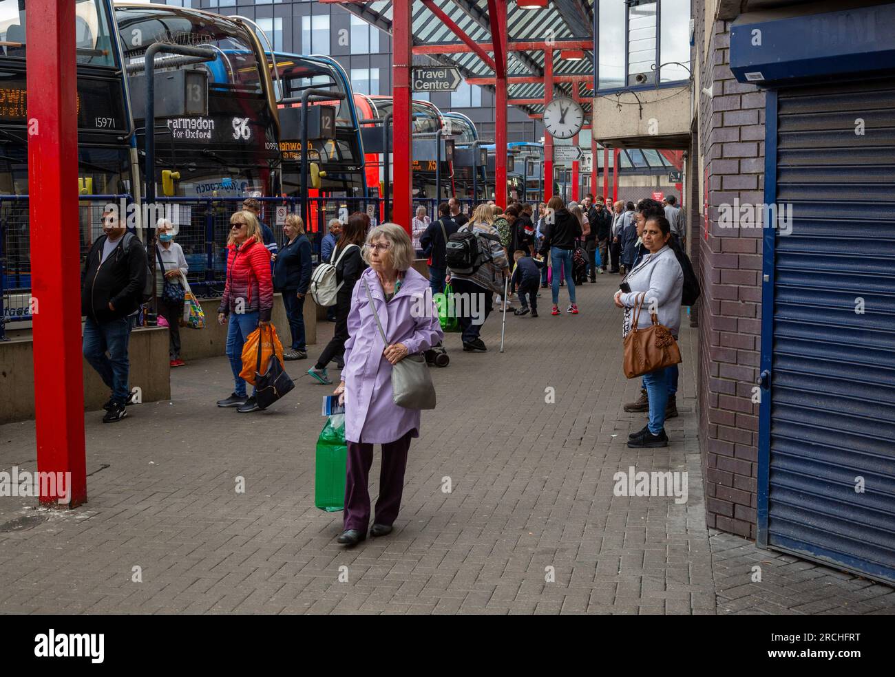 People and buses in bus station in the town centre, Swindon, Wiltshire ...
