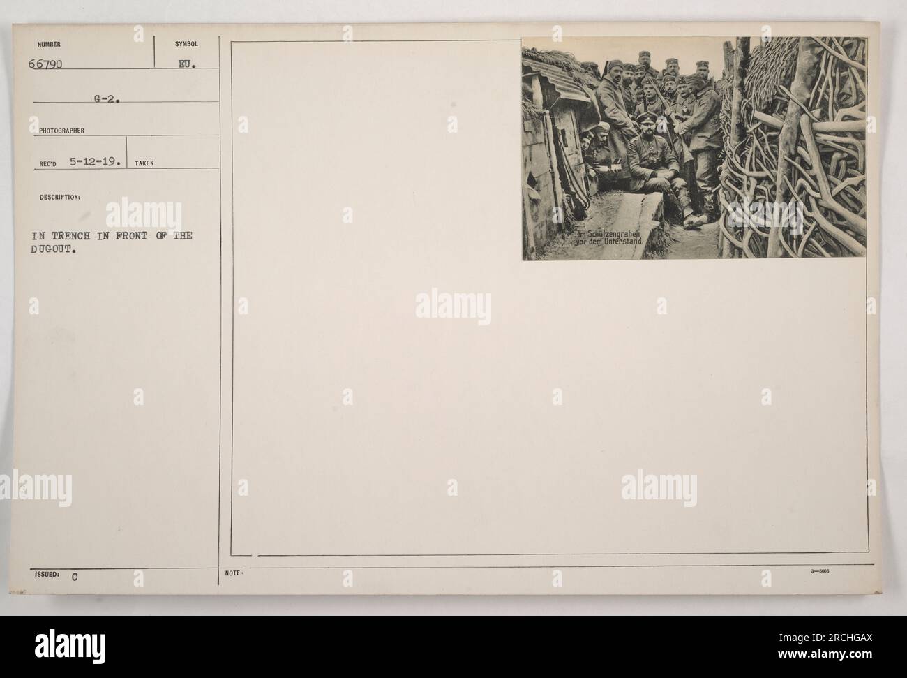 Soldiers taking cover in a trench in front of a dugout during World War ...