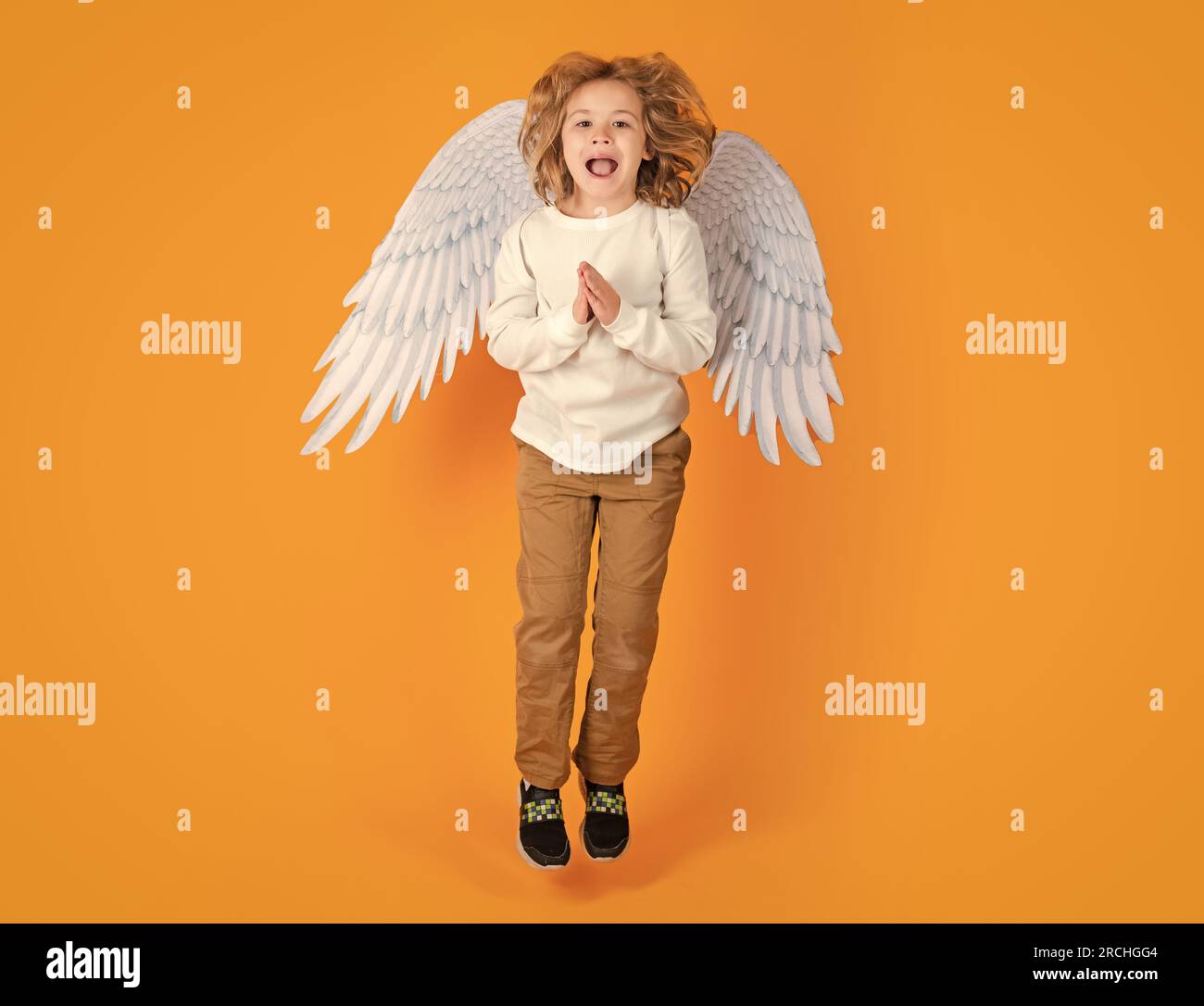 Excited little angel jump, amazed kids jumping. Valentines day. Little ...