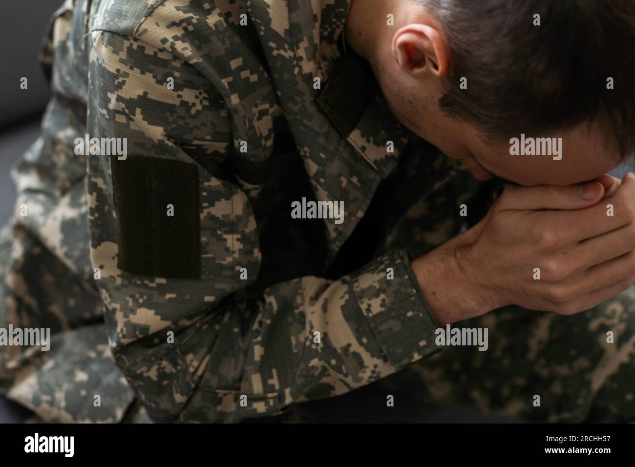 Serious anxious and nervous military man suffers from depression while ...