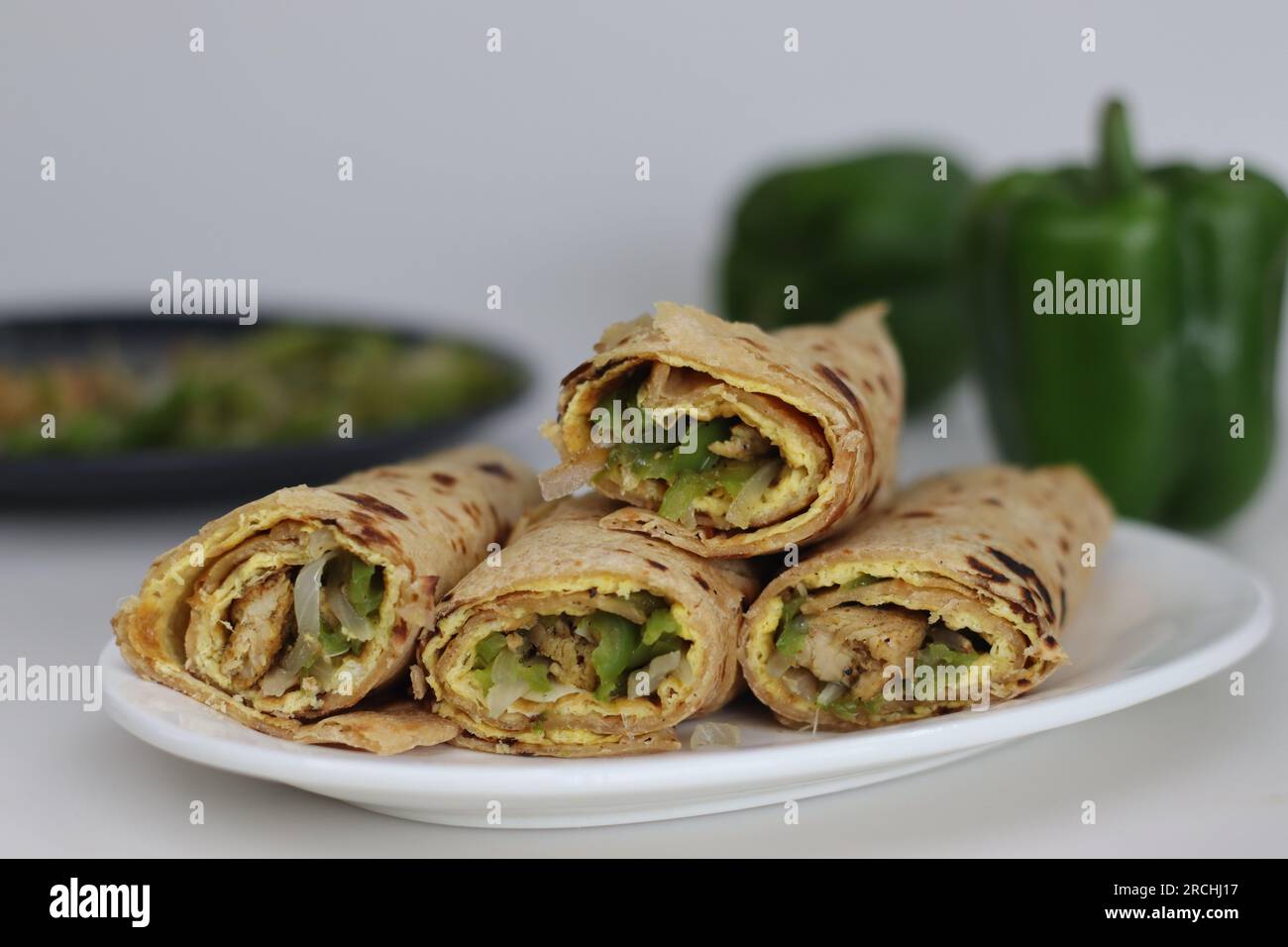 Chicken and egg wrap or Egg chicken roll. Stir fried bell peppers and ...