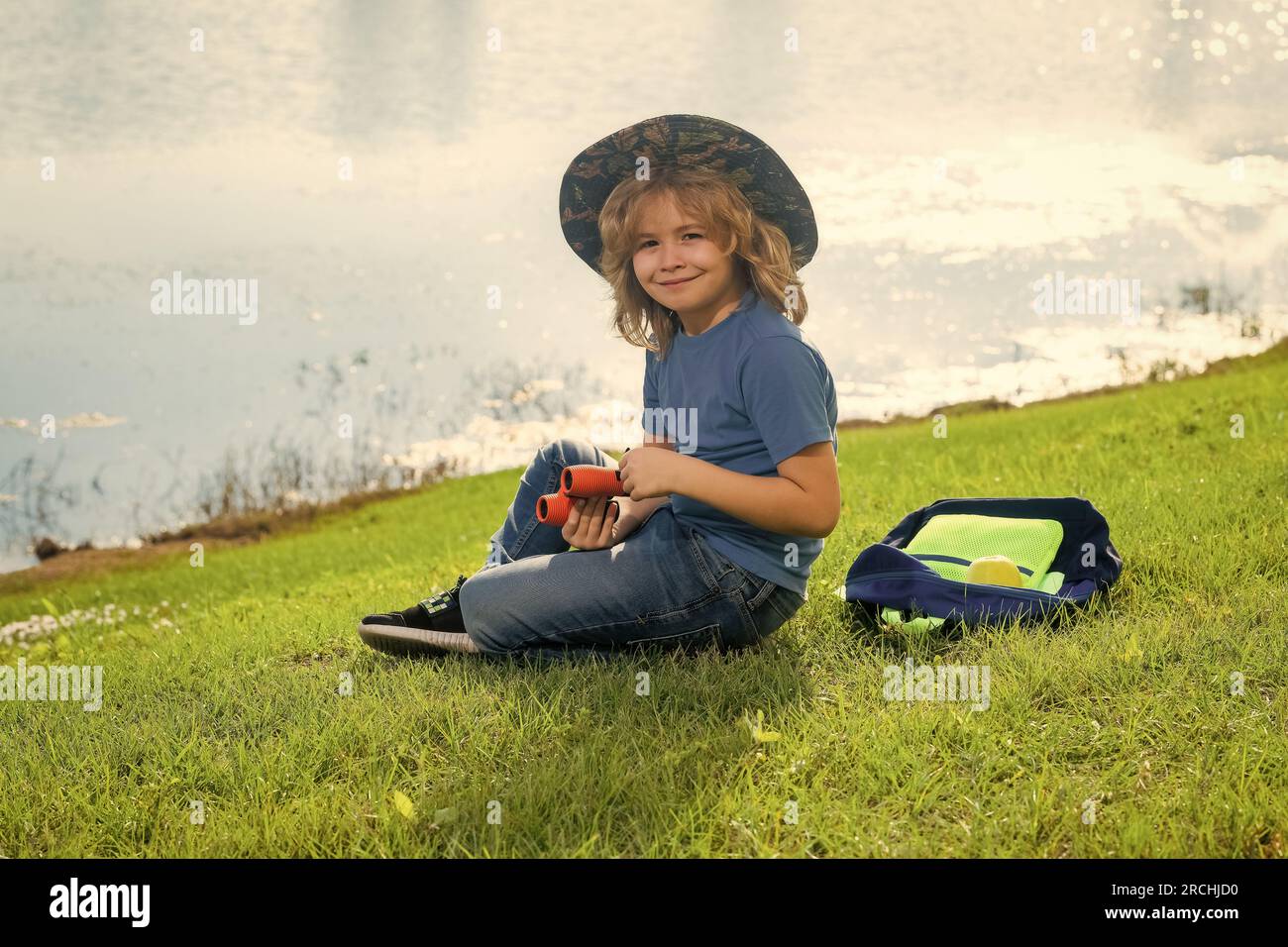 Scout boy wearing explorer hat and backpack outdoor. Explorer and ...