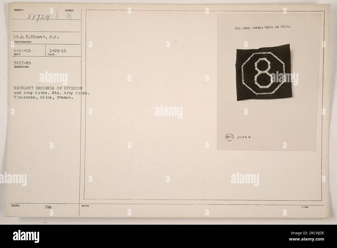 White insignia on a blue background represents the 8th Army Corps of ...