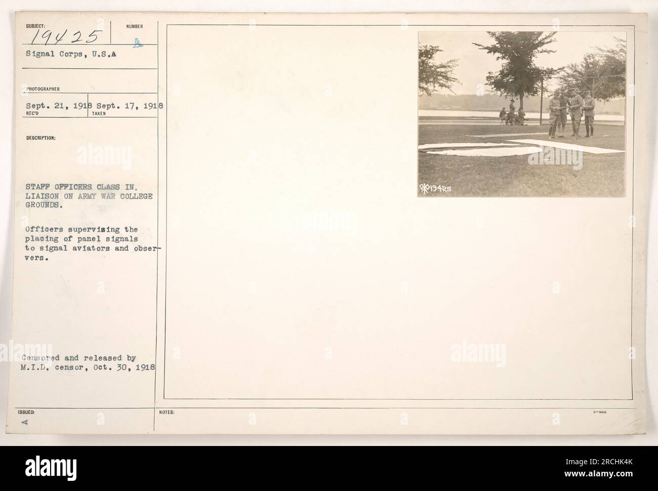 "Staff officers in liaison class observe the placement of panel signals ...
