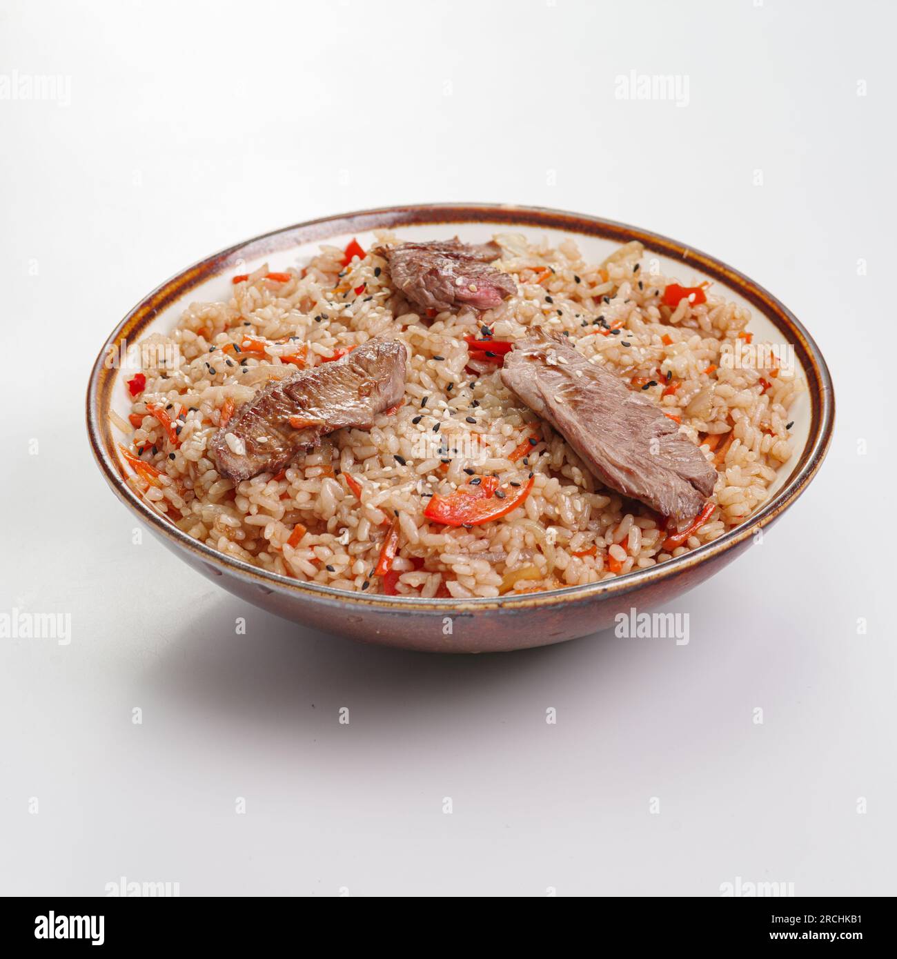 Fried rice with beef and vegetables on white background. Traditional ...