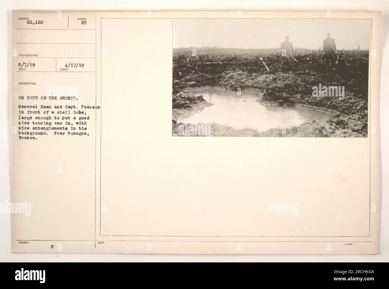 General Haan and Captain Pearson inspect a shell hole near Romagne ...