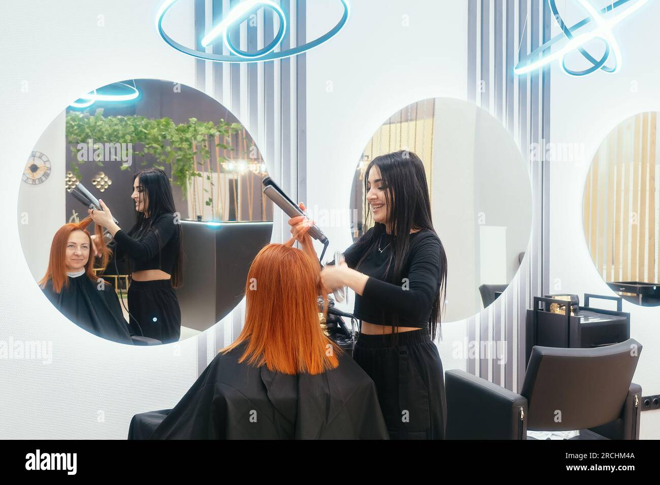Hairstylist doing hairstyle long hair hi-res stock photography and ...