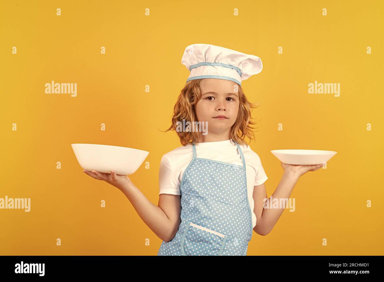 Funny kid chef cook with kitchen plate, studio portrait. Kid chef cook ...
