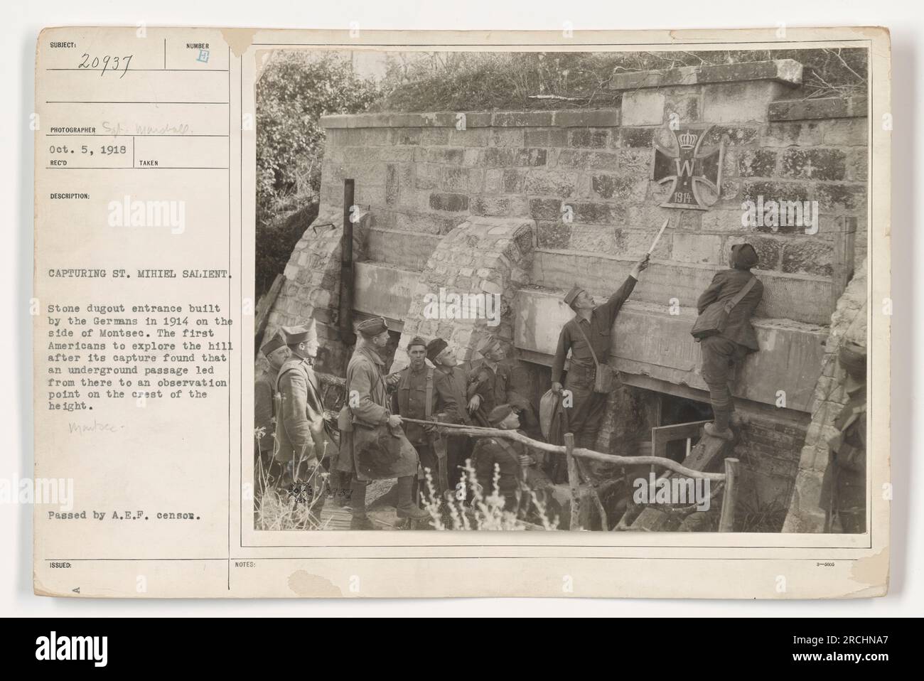 American soldiers entering a stone dugout, believed to be built by ...