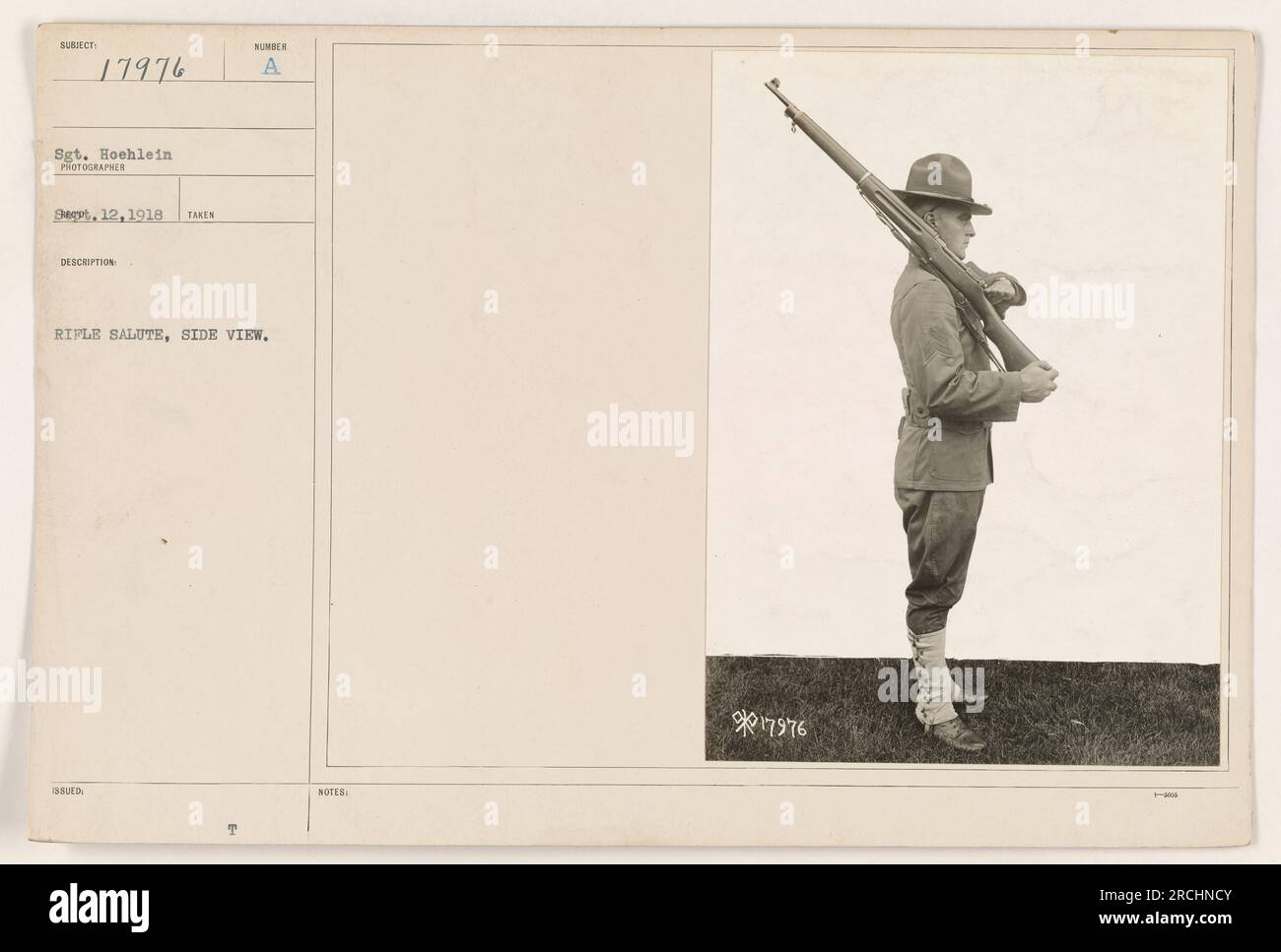 This image shows a soldier, Sgt. Hoehlein, performing a rifle salute ...