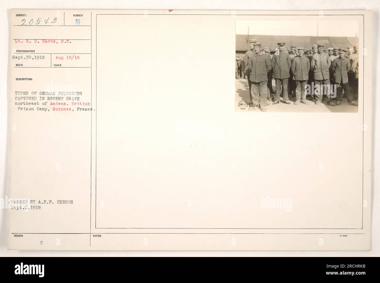 British soldiers stand guard over a group of German prisoners captured ...