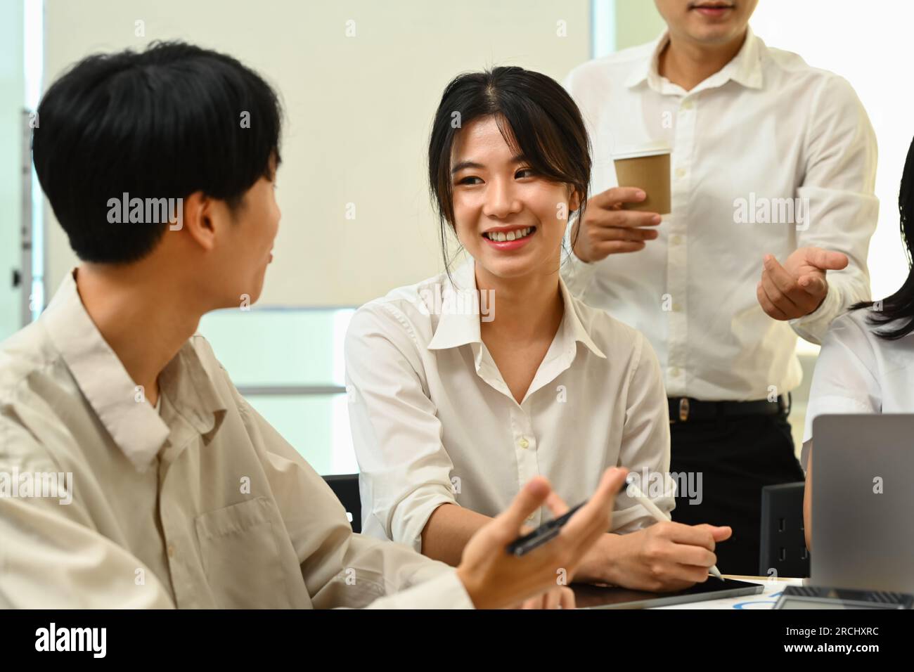 Asian woman employee discussing project planning and advising on ...